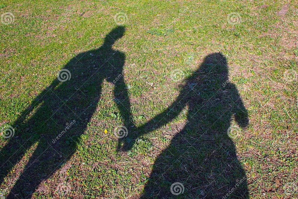 Shadows of Friends on the Grass Stock Photo - Image of devoted, friend ...