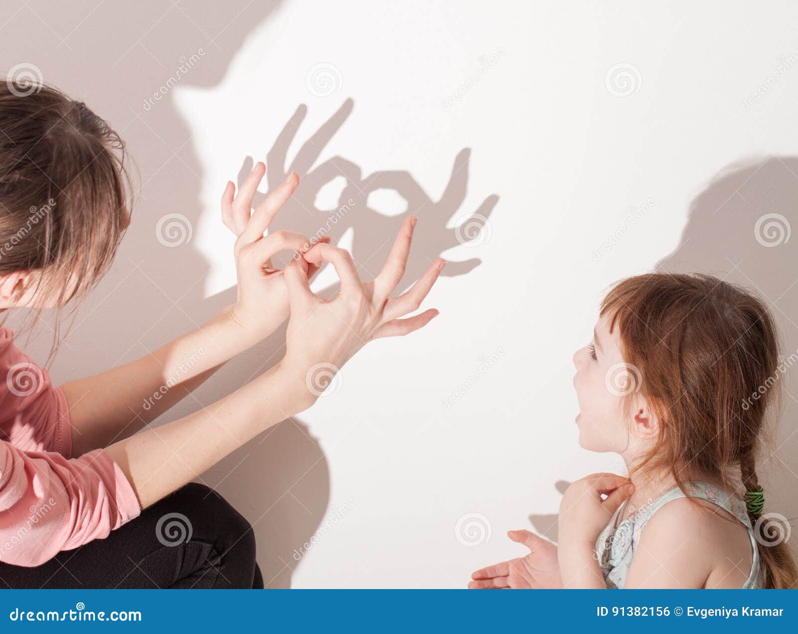 Shadows from the Hand on White Wall Stock Photo - Image of light ...