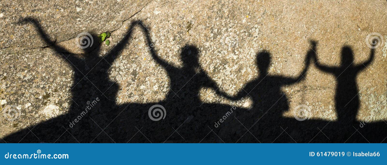 Shadows of Happy People with Arms Raised on Rock Stock Image - Image of ...