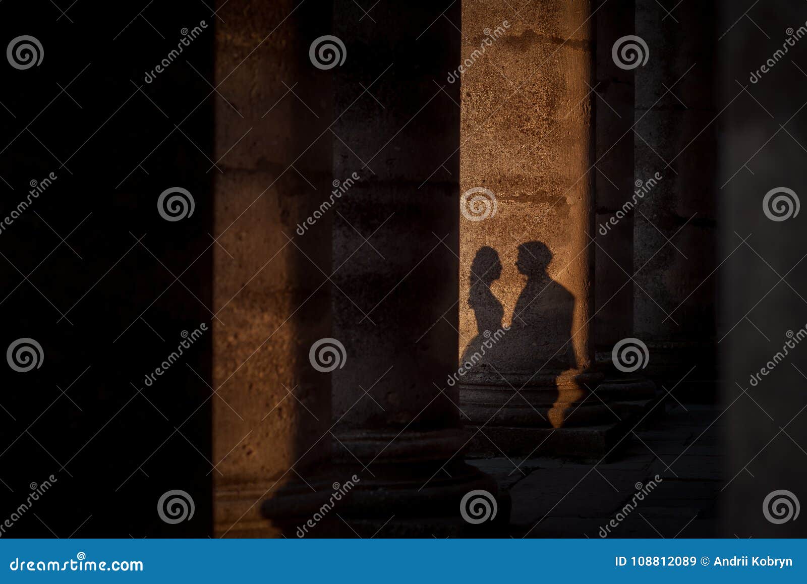 Shadows of the Hugging Newlyweds on the Column of the Old Castle during ...