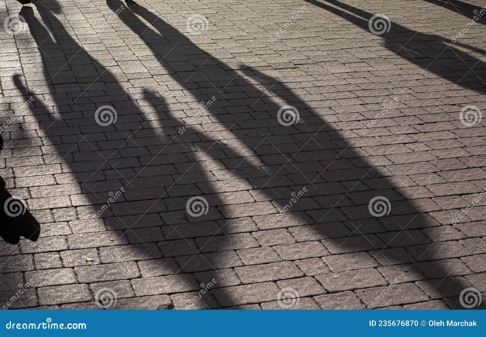 Shadows on Pavement of Two People Walking Under Bright Sunlight Stock ...