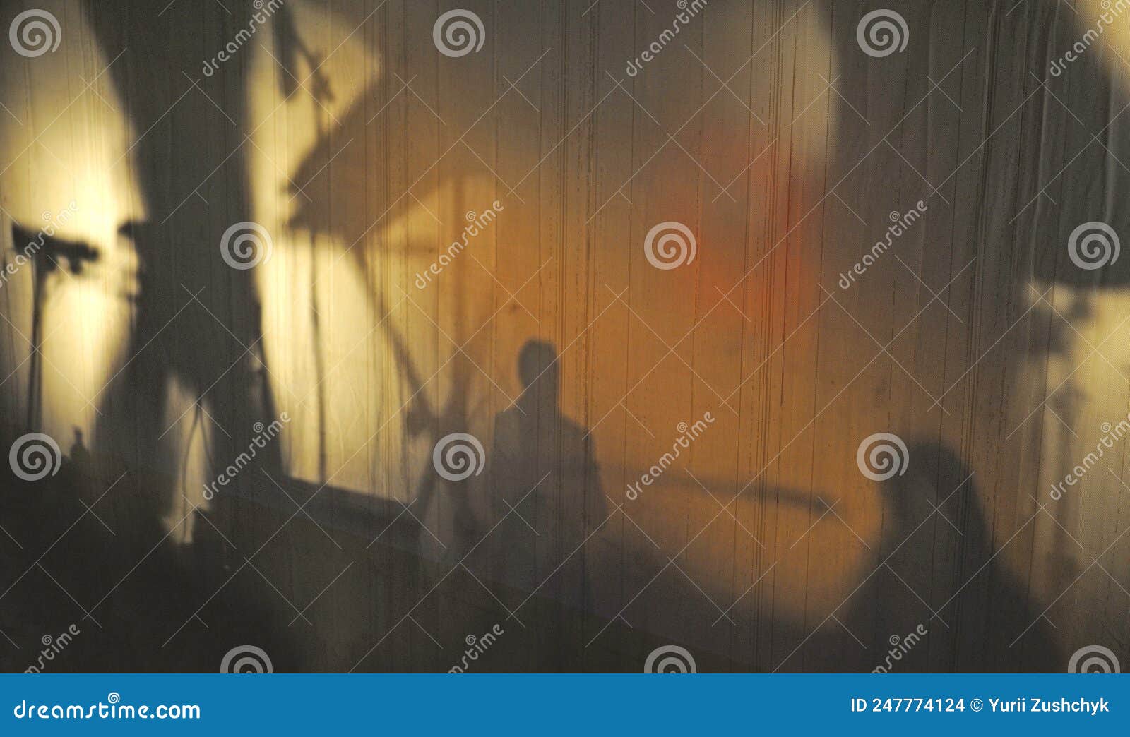 Shadows of People and Musical Instruments Playing on a Screen of a ...