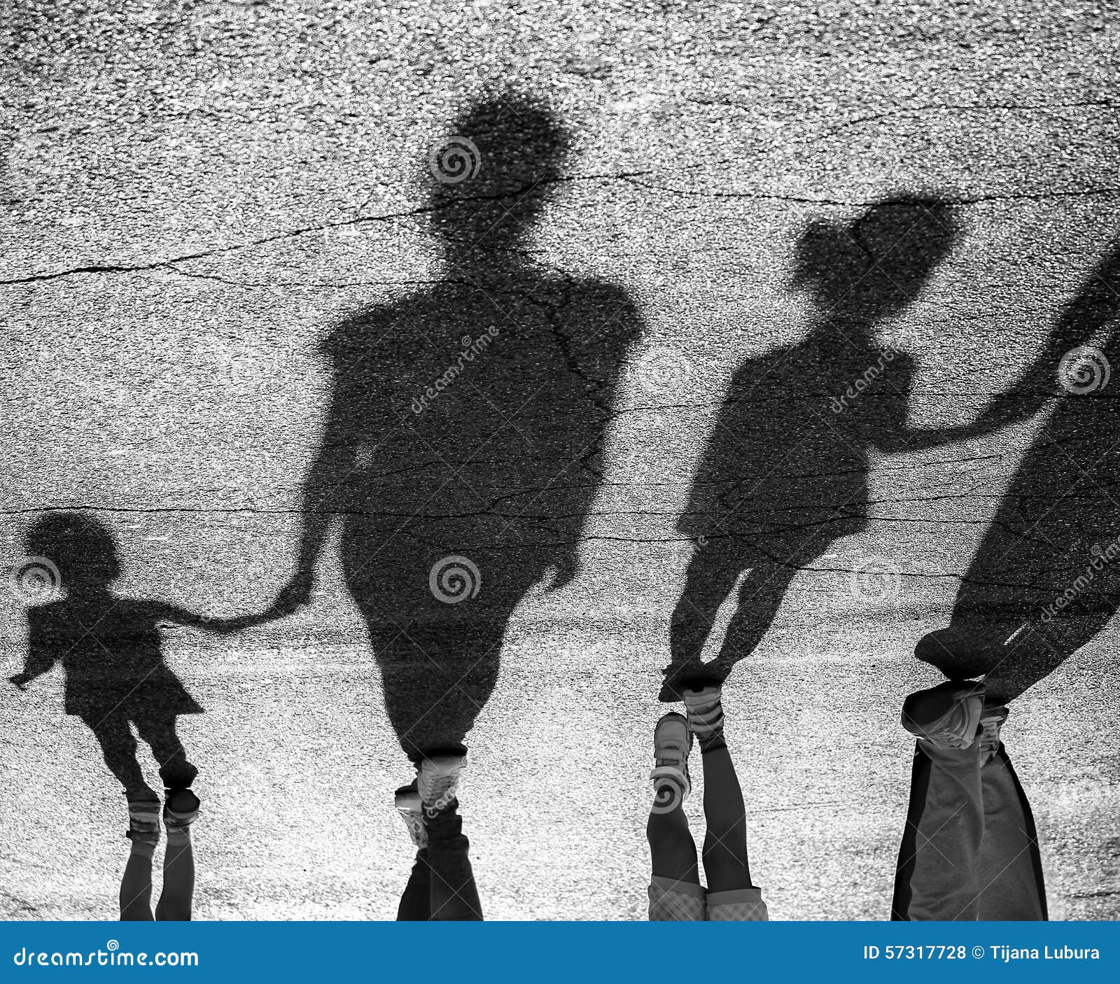 Shadows of people on road stock photo. Image of elongated - 57317728