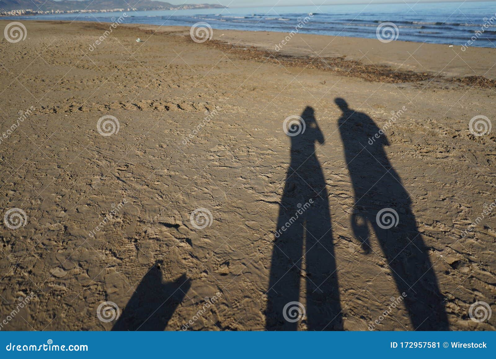 Shadows of People on the Sandy Ground in the Beach Stock Image - Image ...