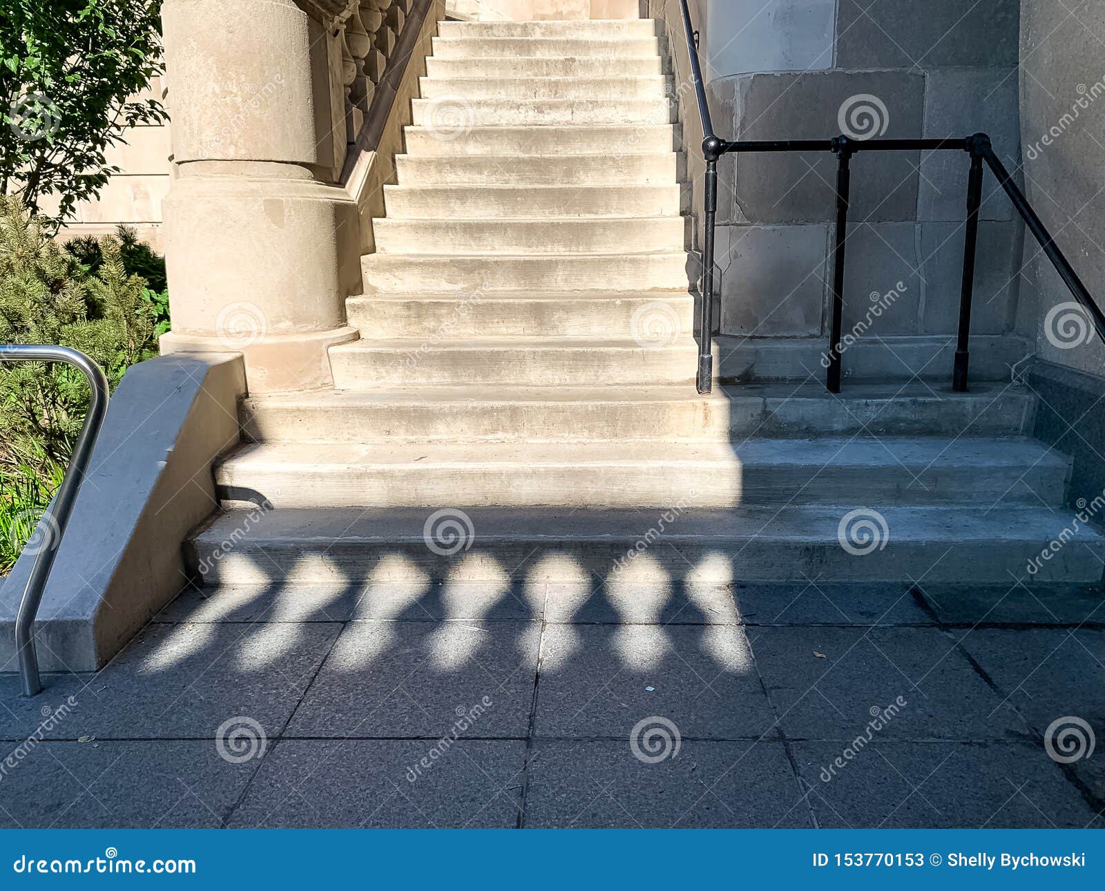 Shadows from Railing on Upper Street Create Pattern on Riverwalk on ...
