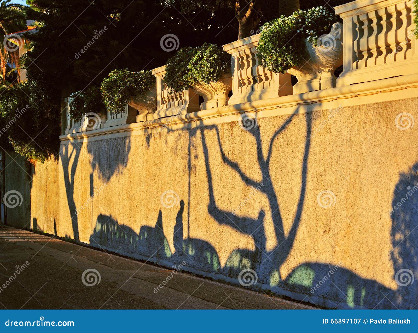 Shadows at Sunset on the Wall and the Silhouettes Stock Image - Image ...