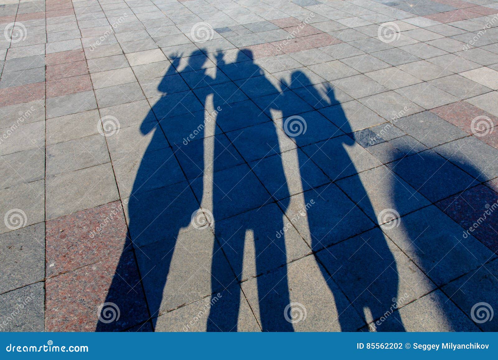 The Shadows of Three People on a Pavement Tiles Stock Photo - Image of ...