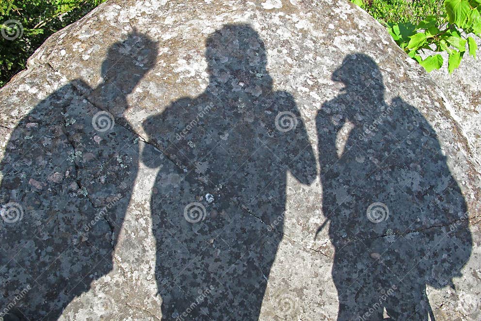 Shadows of three people stock image. Image of daytime - 46030705