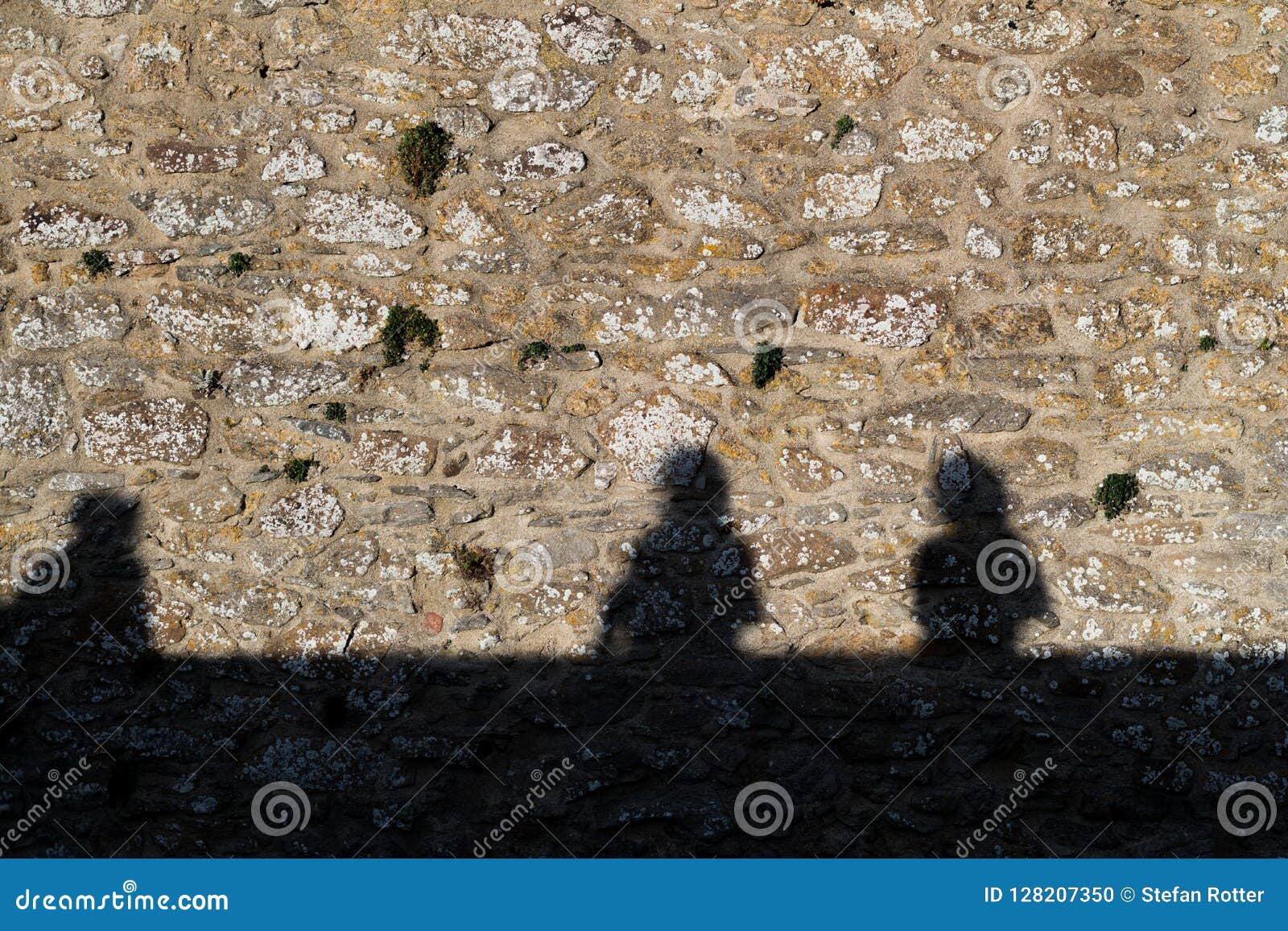 Shadows of Three People on a Stone Wall Stock Photo - Image of adult ...