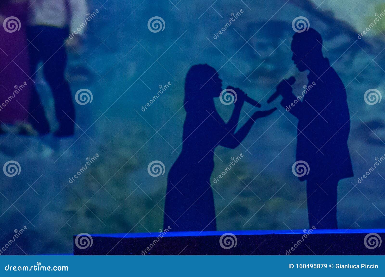 Shadows of Two People Singing Projected on a Wall Stock Image - Image ... Shadows of Two People Singing Projected on a Wall Stock Image - Image ...