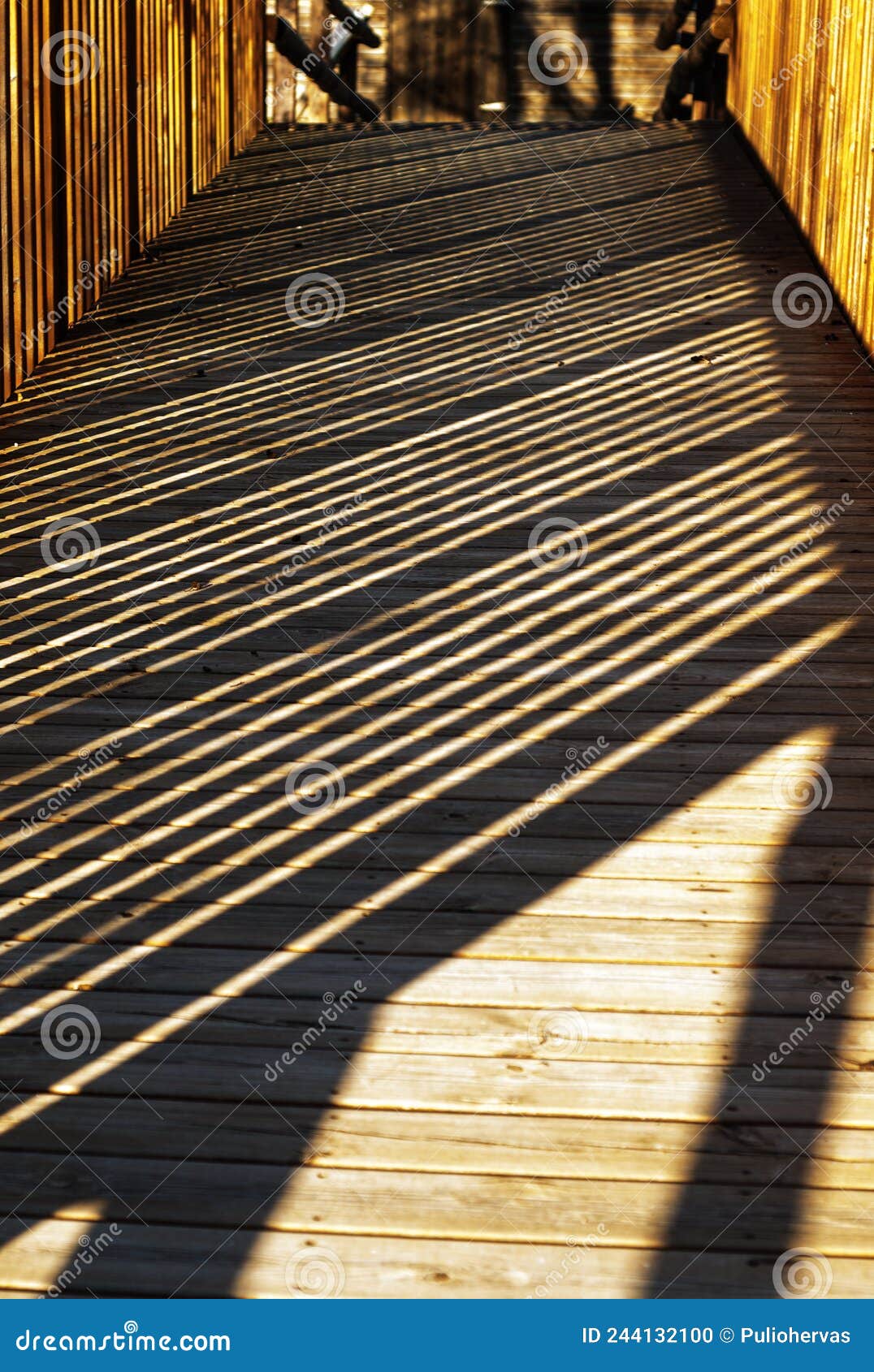 Shadows On Wooden Walkway With Wooden Railing Forming Vertical Diagonal ...