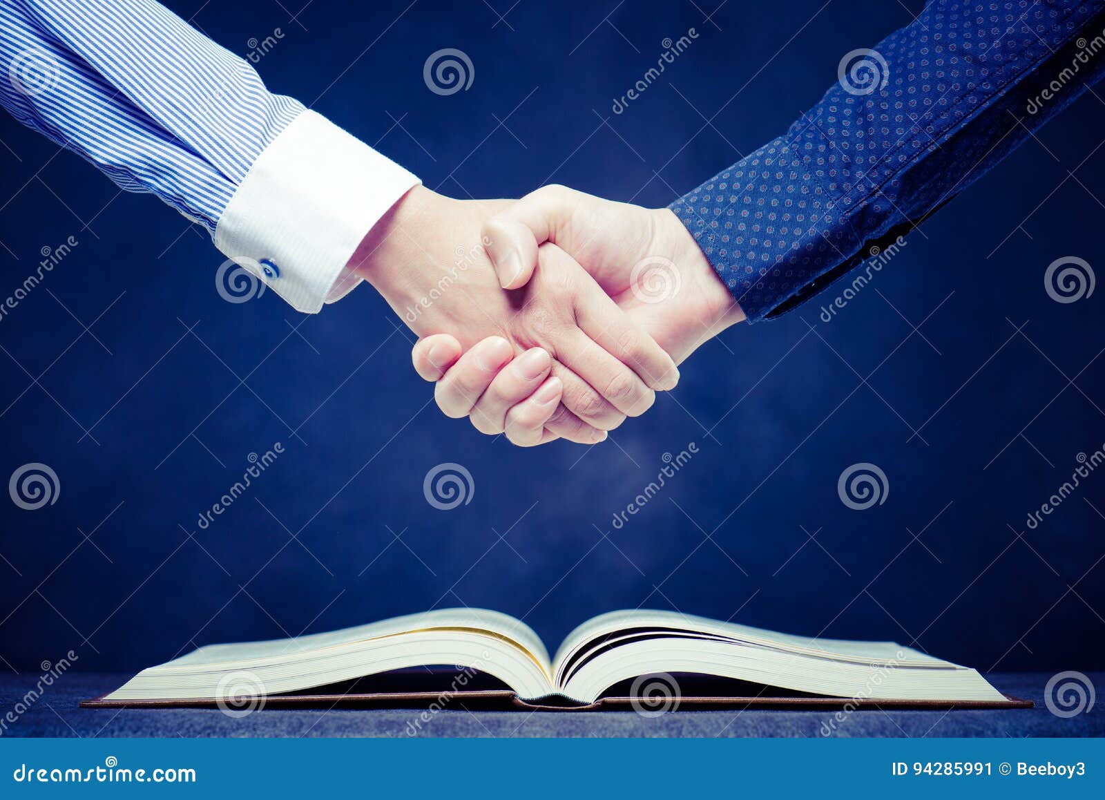 Shake hands on open books stock image. Image of money - 94285991