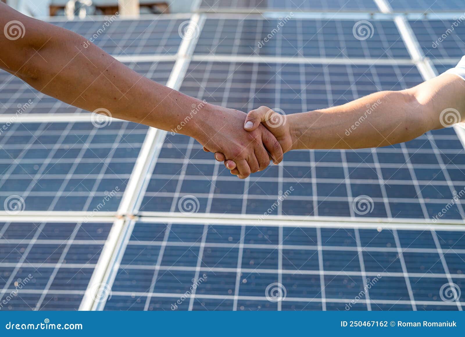 Shaking Hands Against Solar Panel after the Conclusion of the Agreement ...