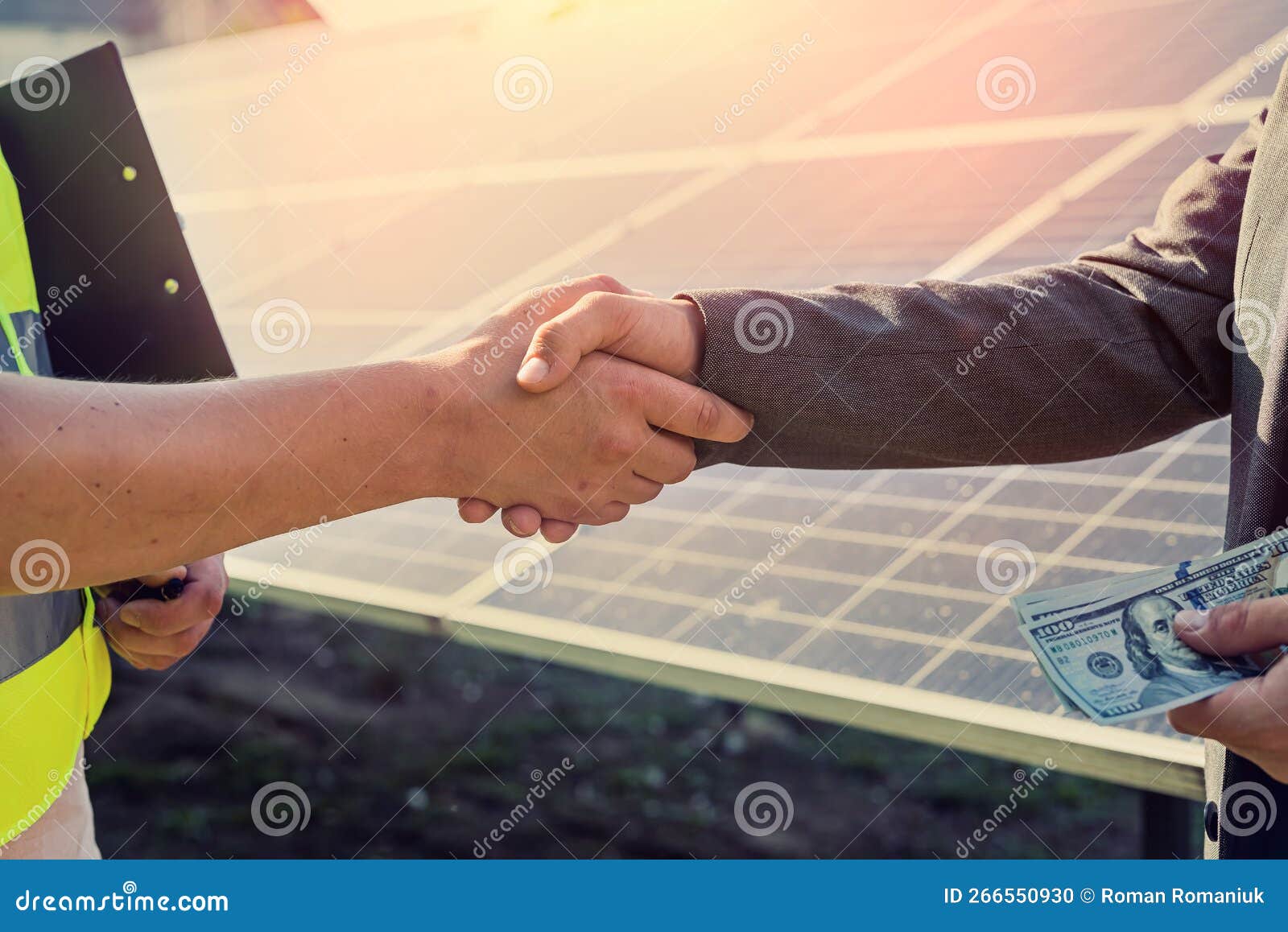 Shaking Hands Against Solar Panel after the Conclusion of the Agreement ...
