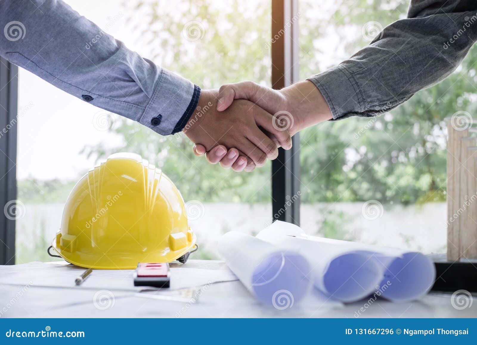 Shaking Hands of Collaboration, Construction Engineering or Architect ...