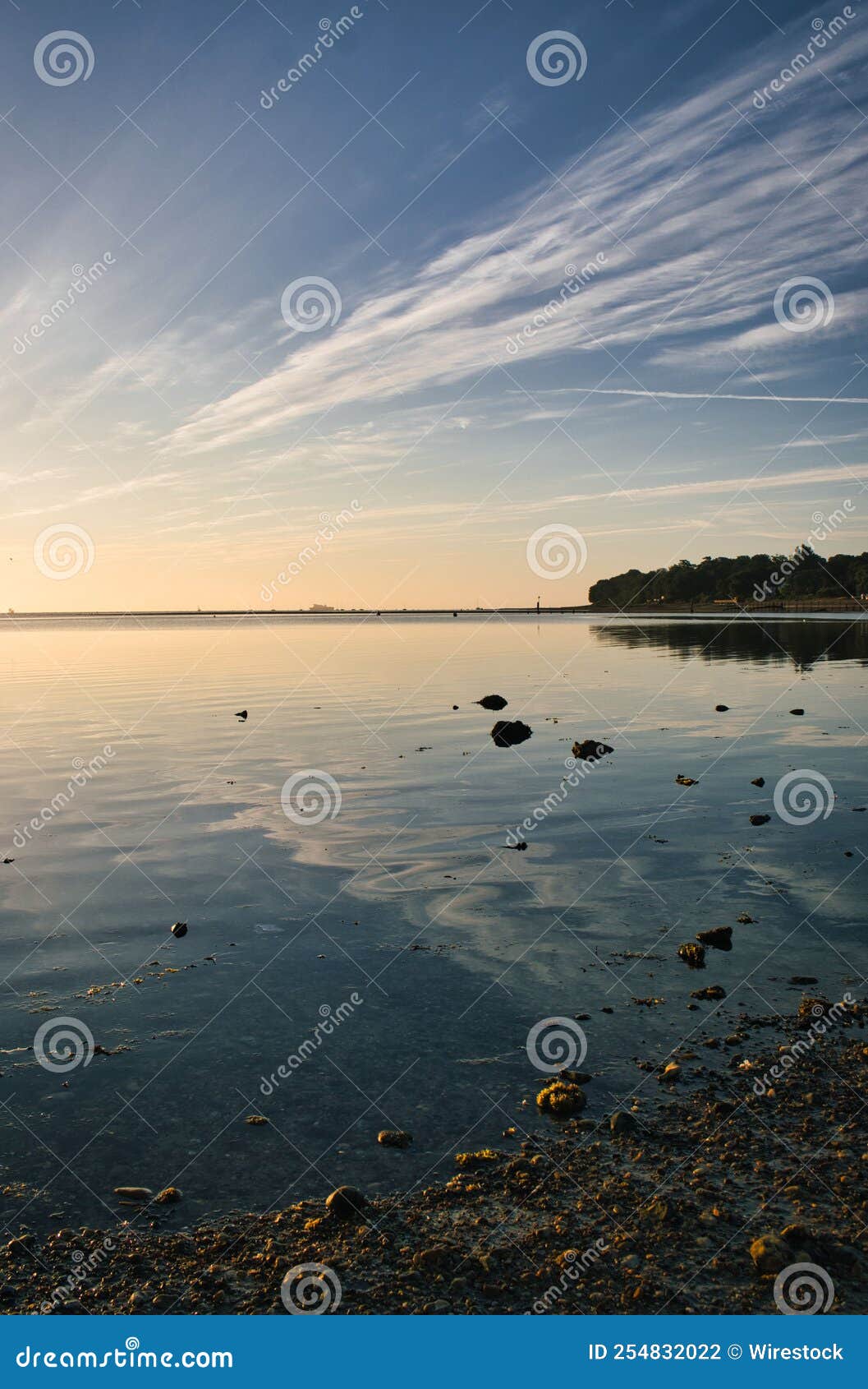 Shallow Beach Near with a Mesmerizing Landscape and Skyline, Vertical ...