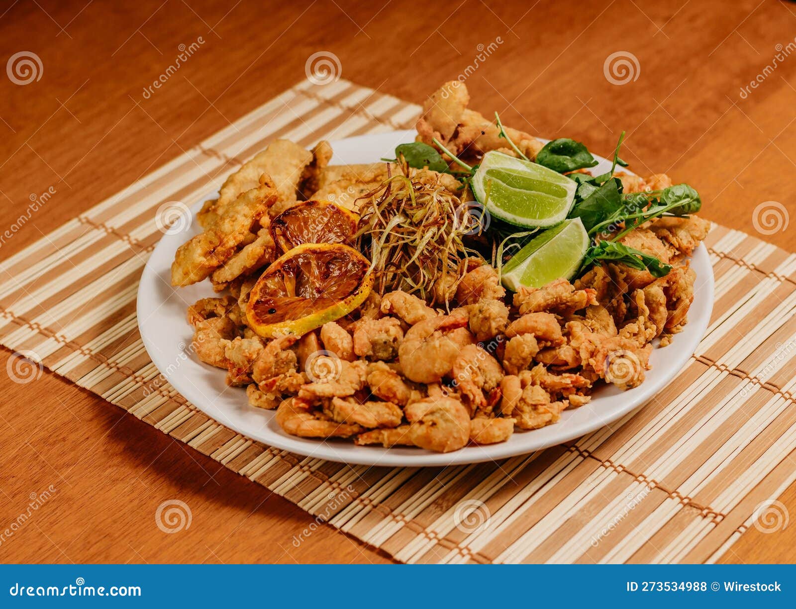 Shallow Ceramic Plate with a Variety of Fried Food Stock Photo - Image ...