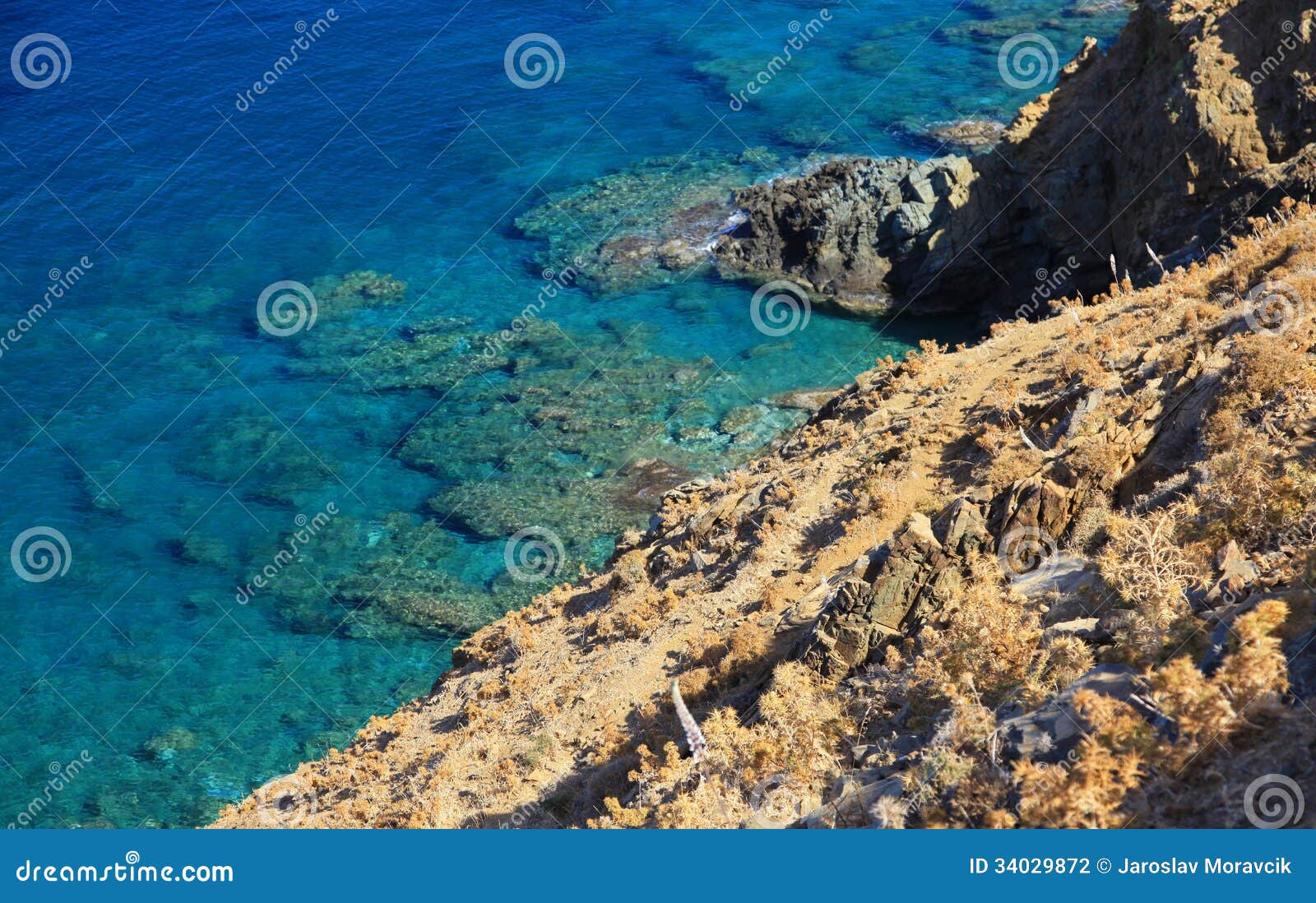 Shallow clear sea of Crete stock photo. Image of crete - 34029872