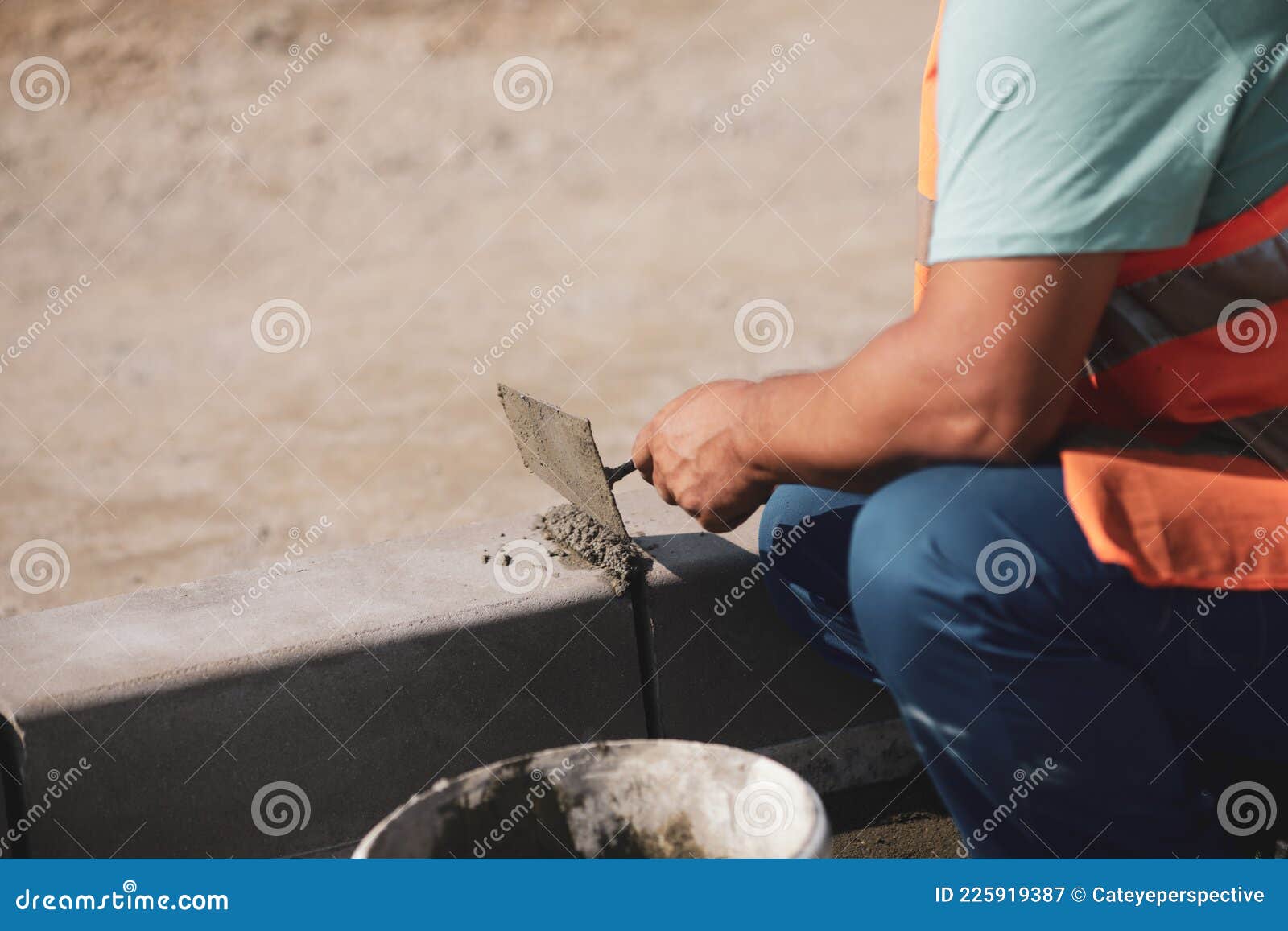 Shallow Depth of Field Selective Focus Image with a Worker Cementing a ...