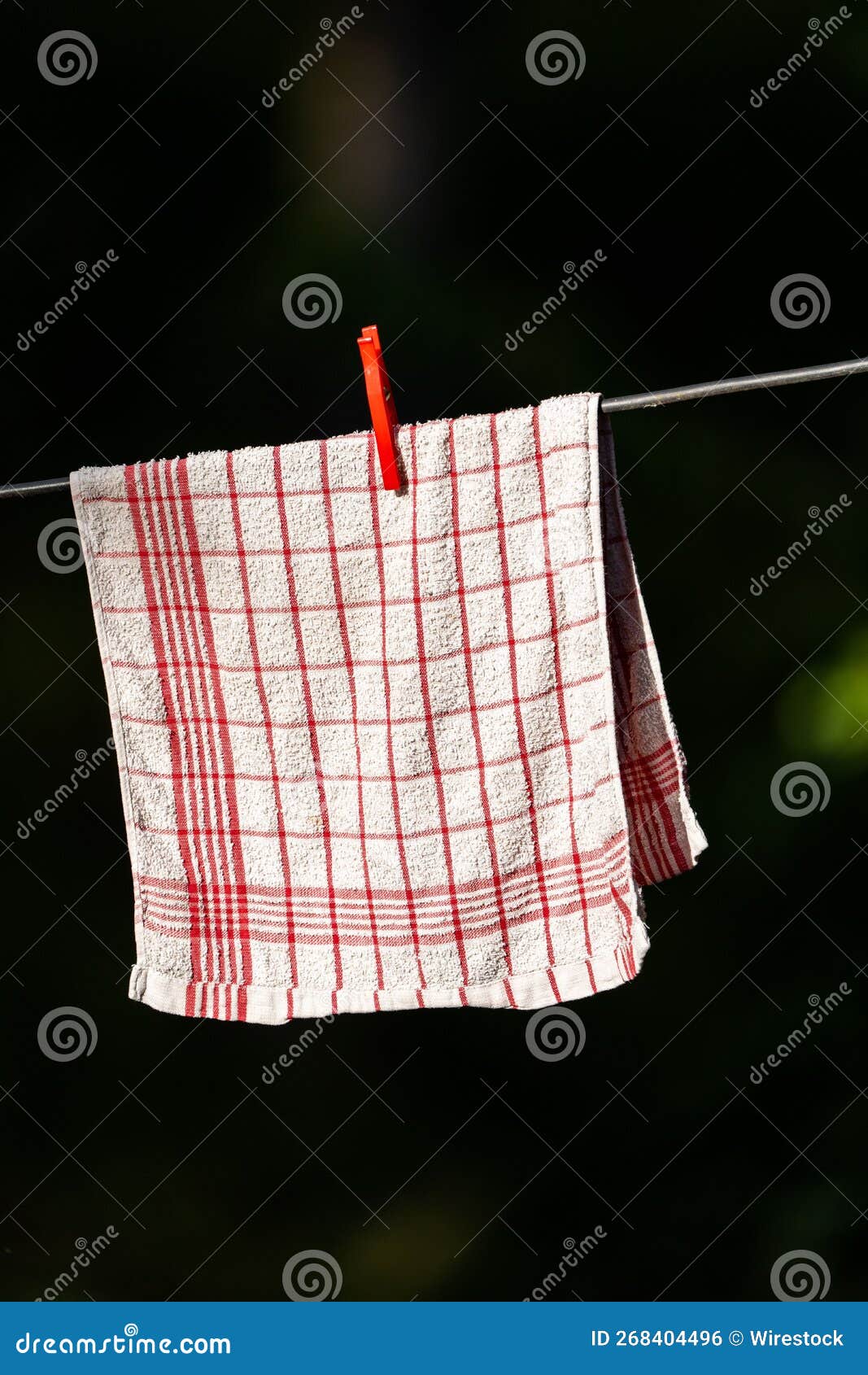 Shallow Focus of a Decorated Kitchen Cloth Spread on a Rope with a Pin ...