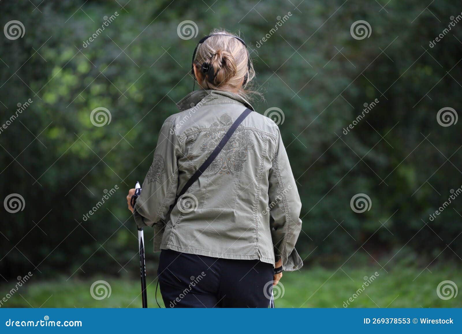 Shallow Focus Shot of the Back Profile of a Female Walking in a Park ...