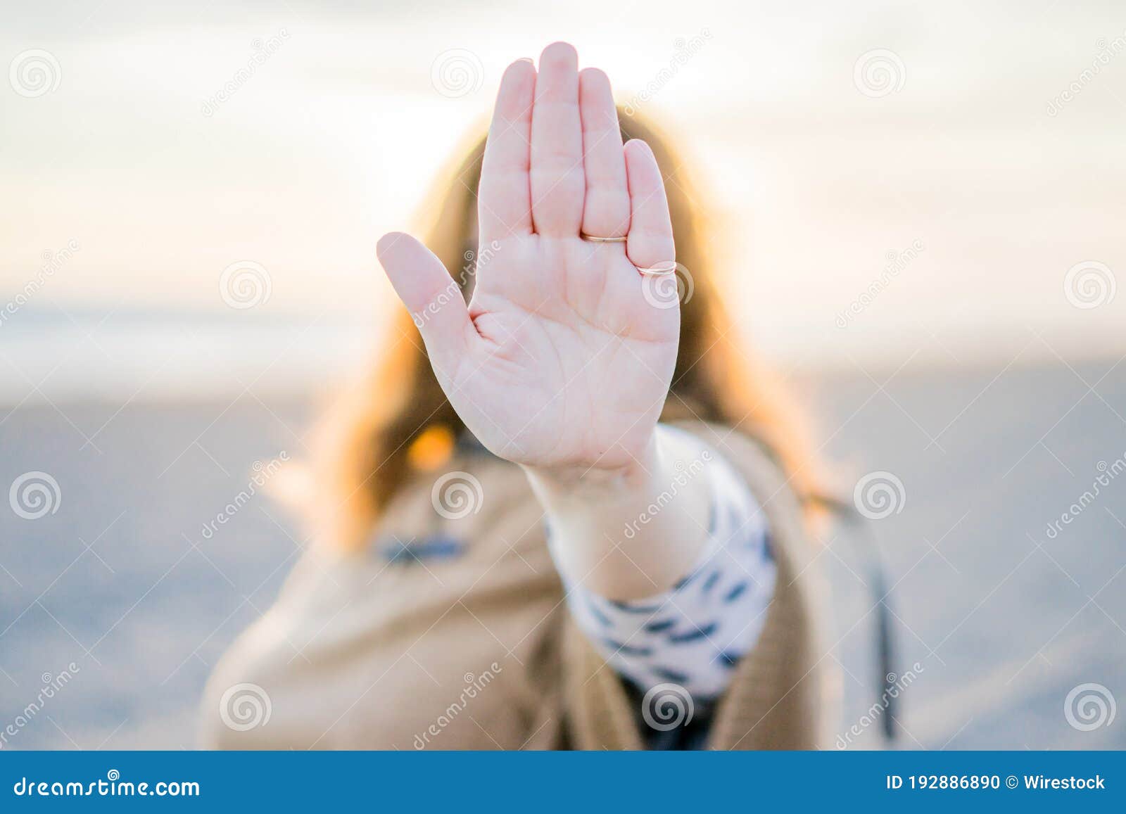 Shallow Focus Shot of a Female Hand Gesturing a Stop Sign Stock Photo ...