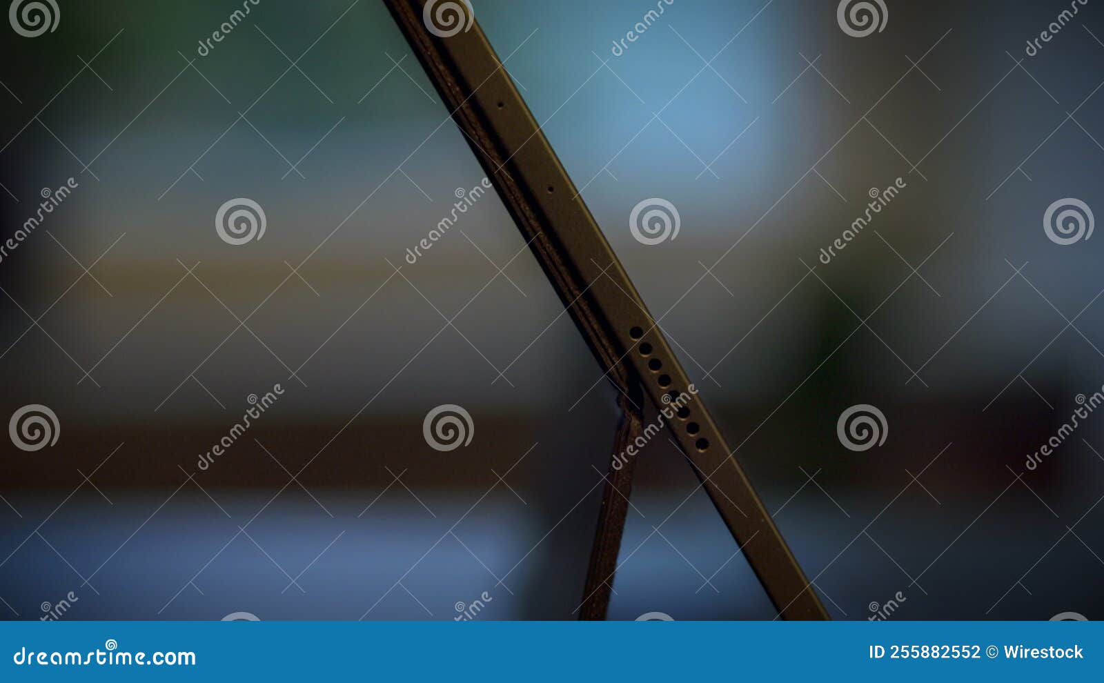 Shallow Focus Shot of the Side of a Tablet with Keyboard on Black Table ...