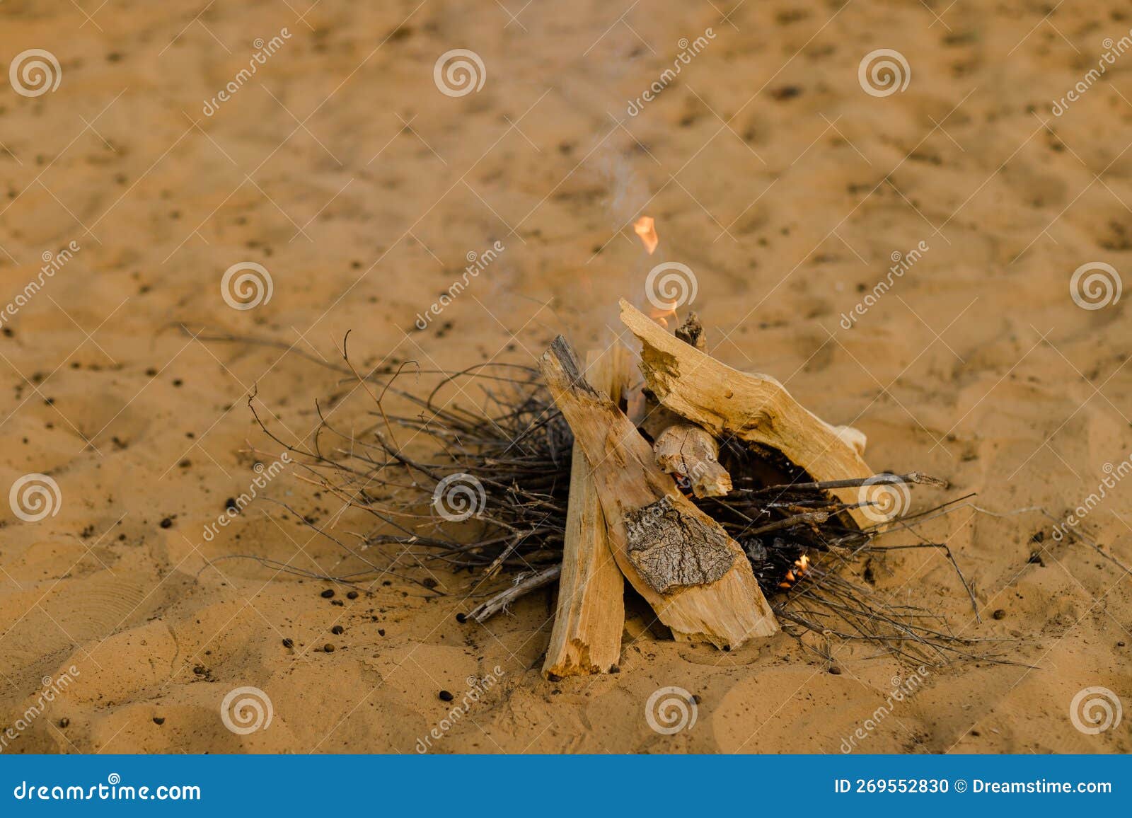 Shallow Focus Shot of a Small Bonfire in the Middle of a Desert for ...