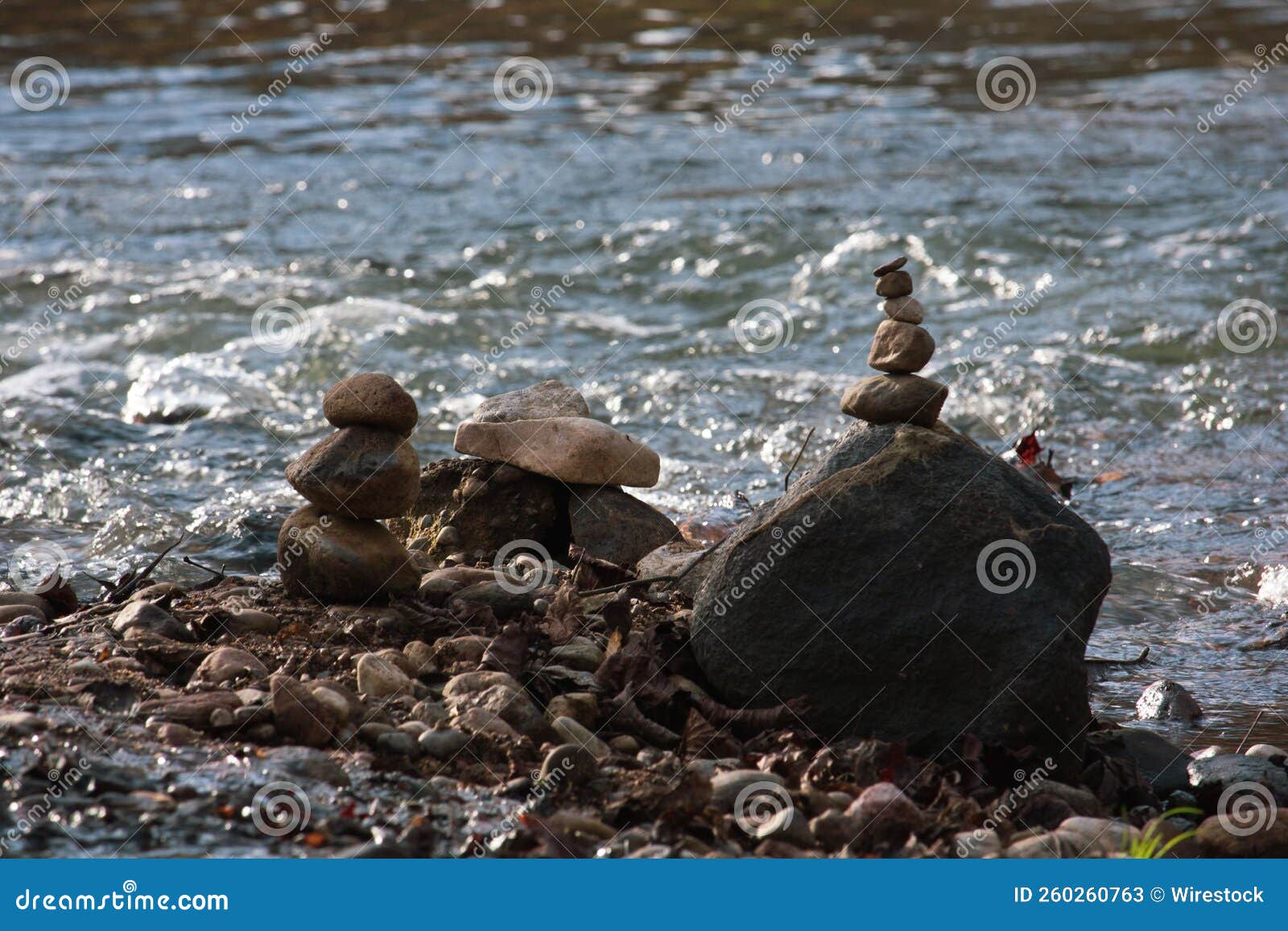 Shallow Focus Shot of a Stack of Balancing Rocks in the Water - Zen ...