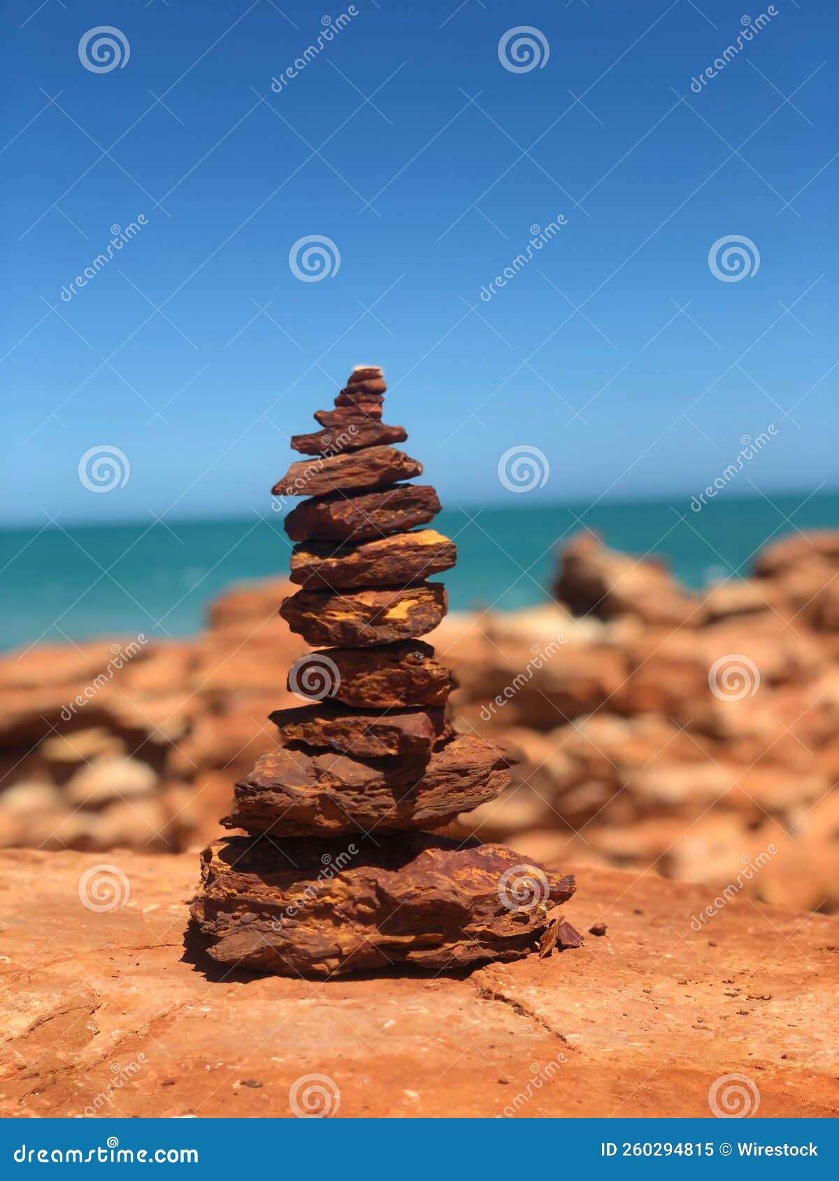 Shallow Focus Shot of a Stack of Stones Column on Rocky Ground with ...