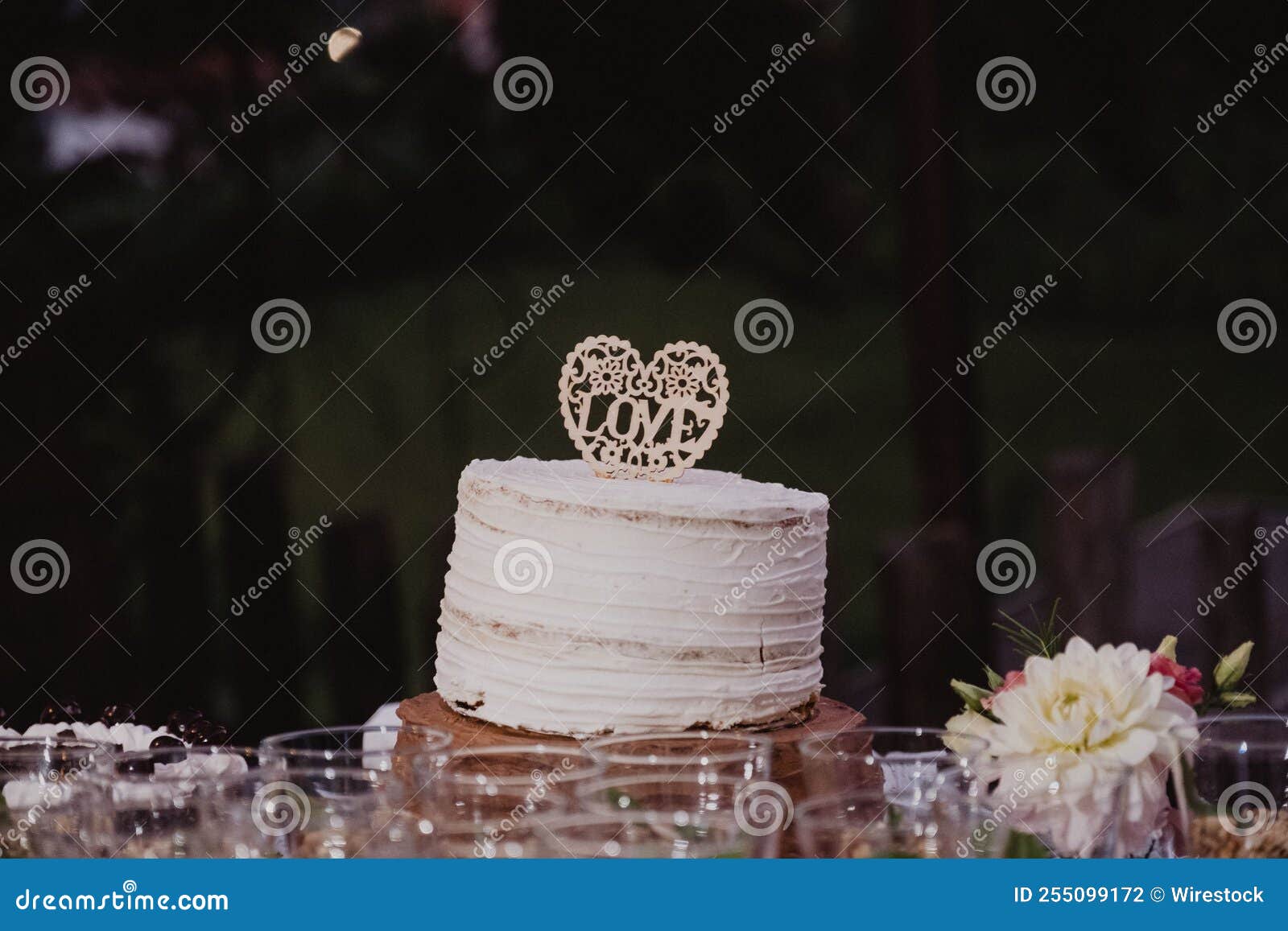 Shallow Focus Shot of a Wedding Cake on a Sweets Table in the Evening ...