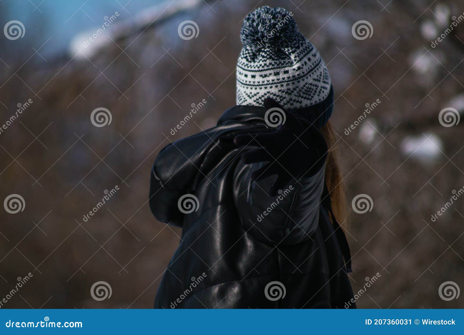 Shallow Focus Shot of a Young Female in a Knitted Hat Posing at Camera ...