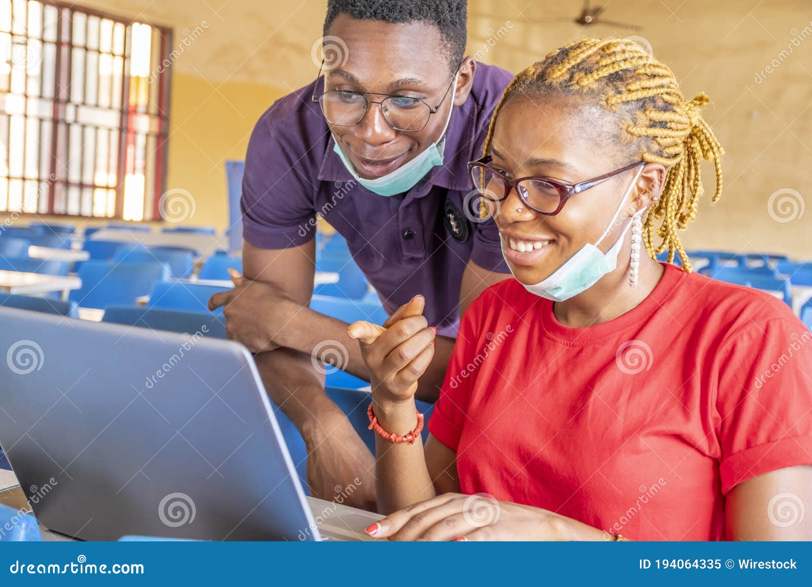 Shallow Focus of Two Young African Students Wearing Facemasks and Using ...