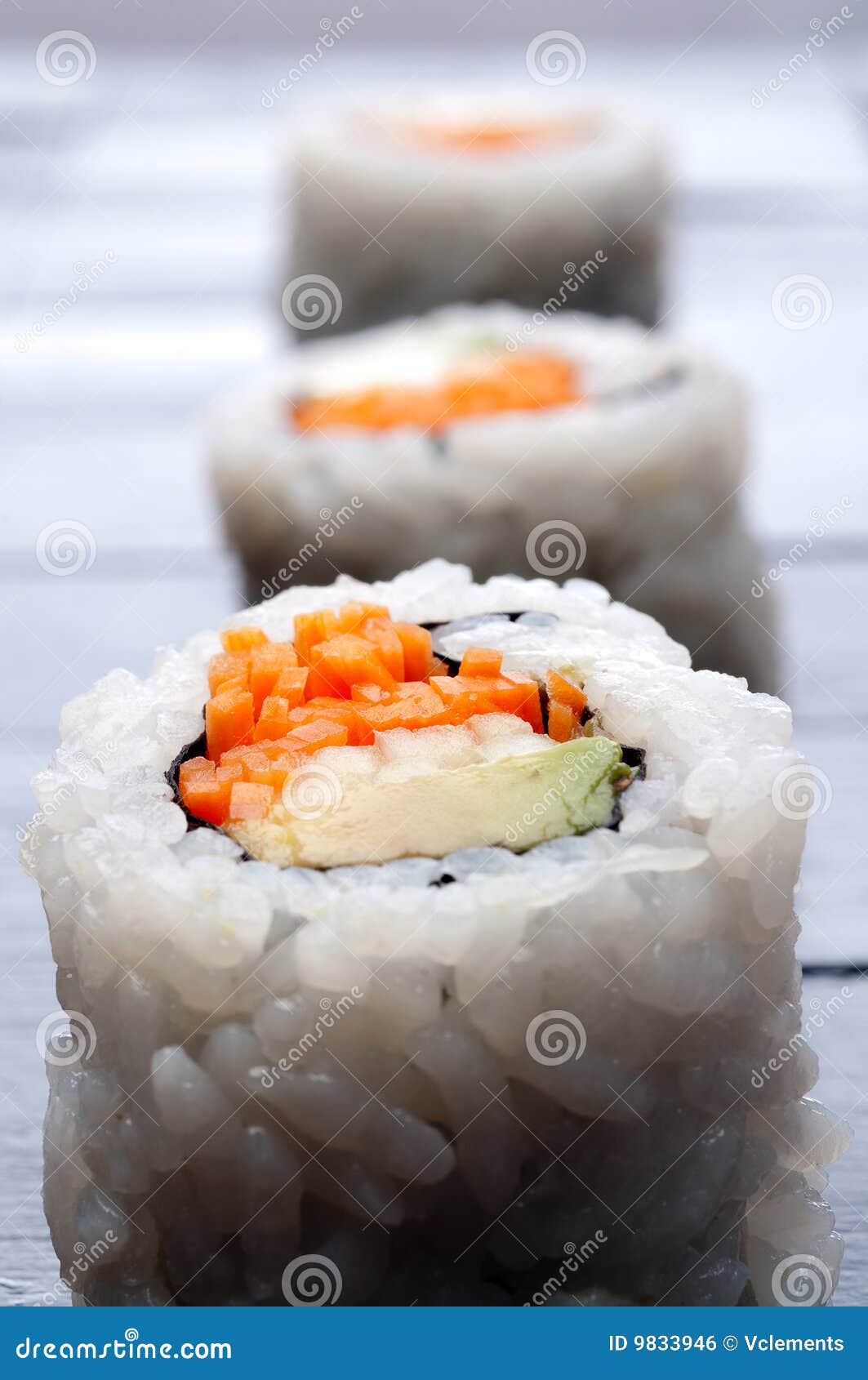 Shallow Focus Vertical Macro of 3 Rolls of Sushi Stock Photo - Image of ...