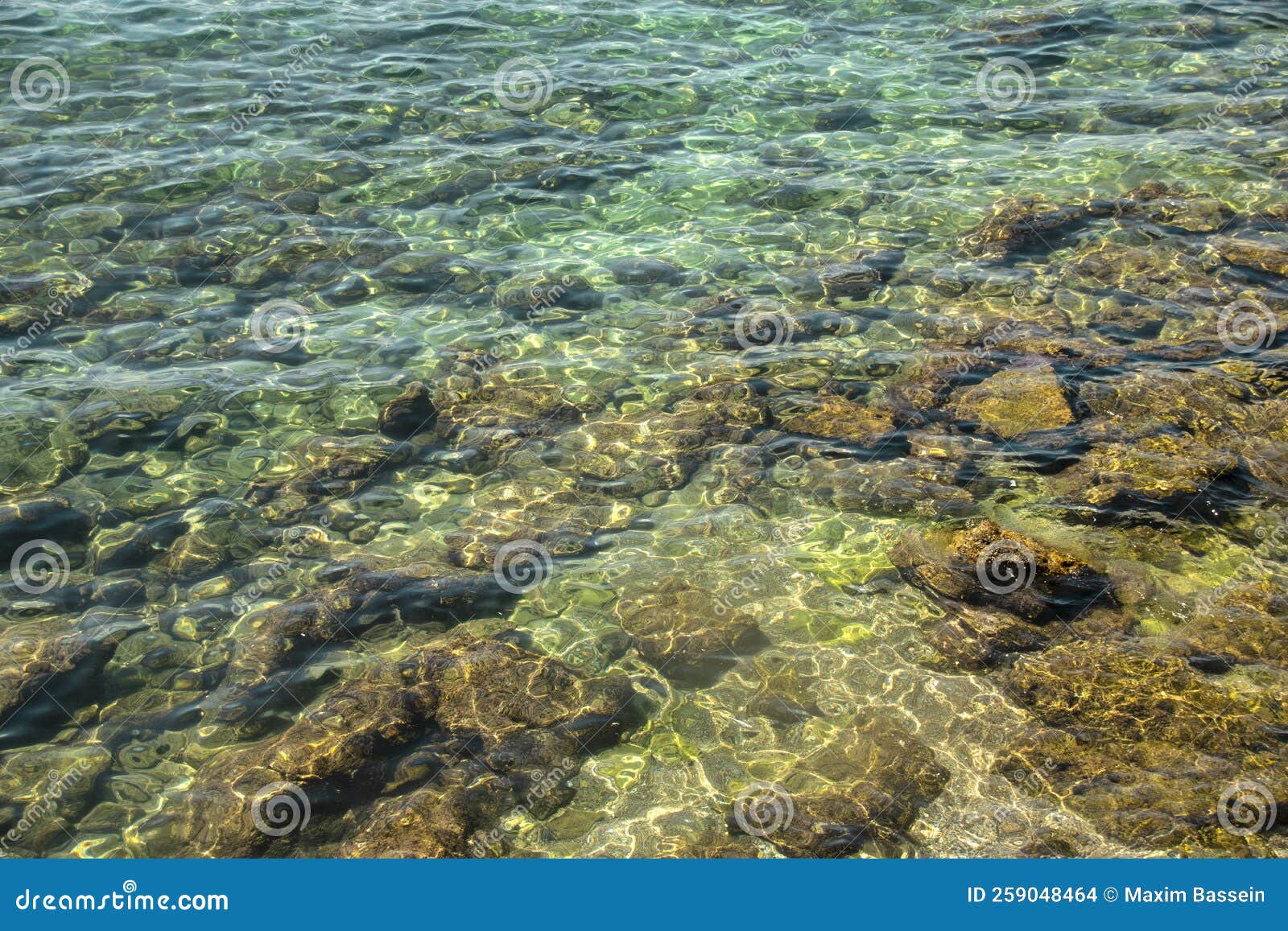 Shallow Sea with Rocks and Clear Blue Water Stock Photo - Image of ...