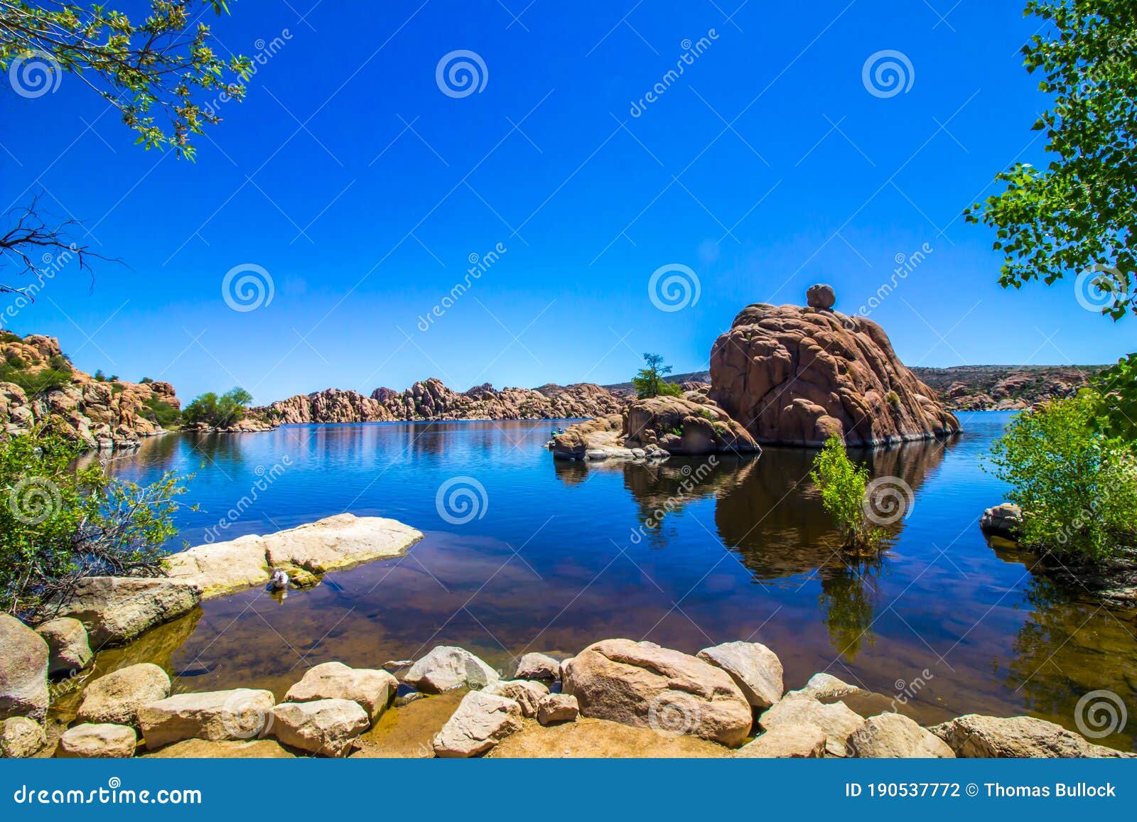 Shallow Shoreline of Lake with Unique Rock Formations Stock Photo ...