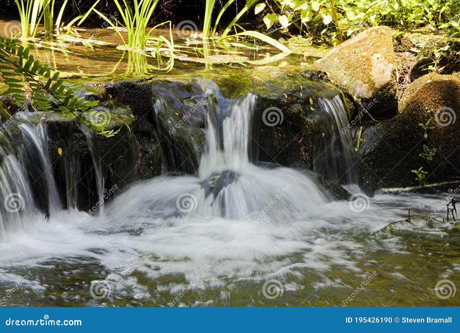 A Clear Shallow Stream Cascades Over Low Rocks Stock Photo - Image of ...