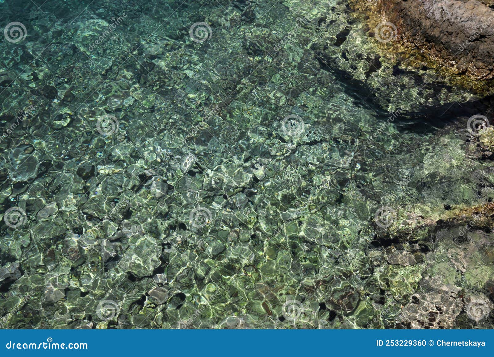 Shallow Water with Rocky Sea Bottom As Background, Top View Stock Photo ...