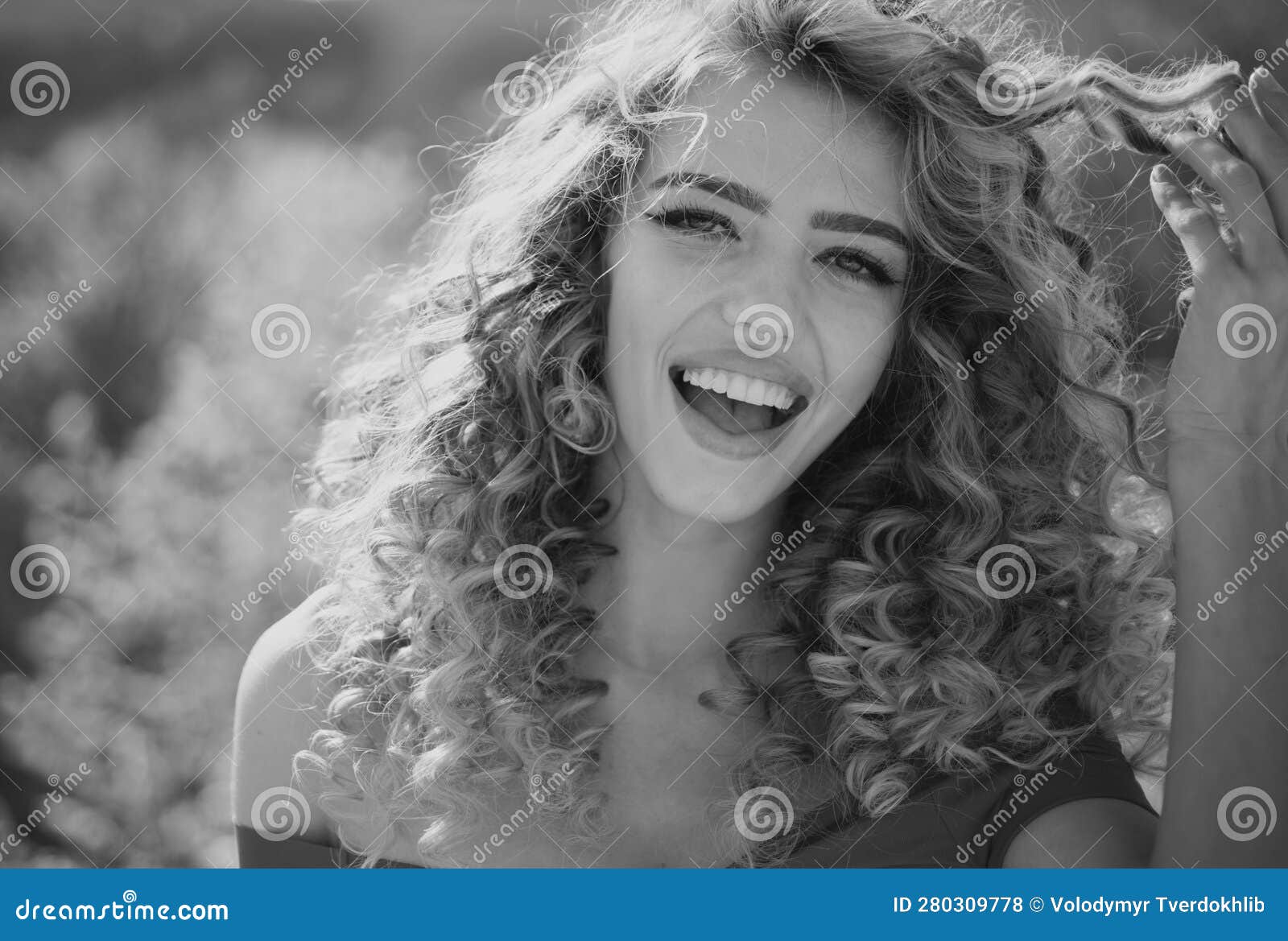 Shampoo Concept Curly Hair Woman Holding Curly Hair On Spring