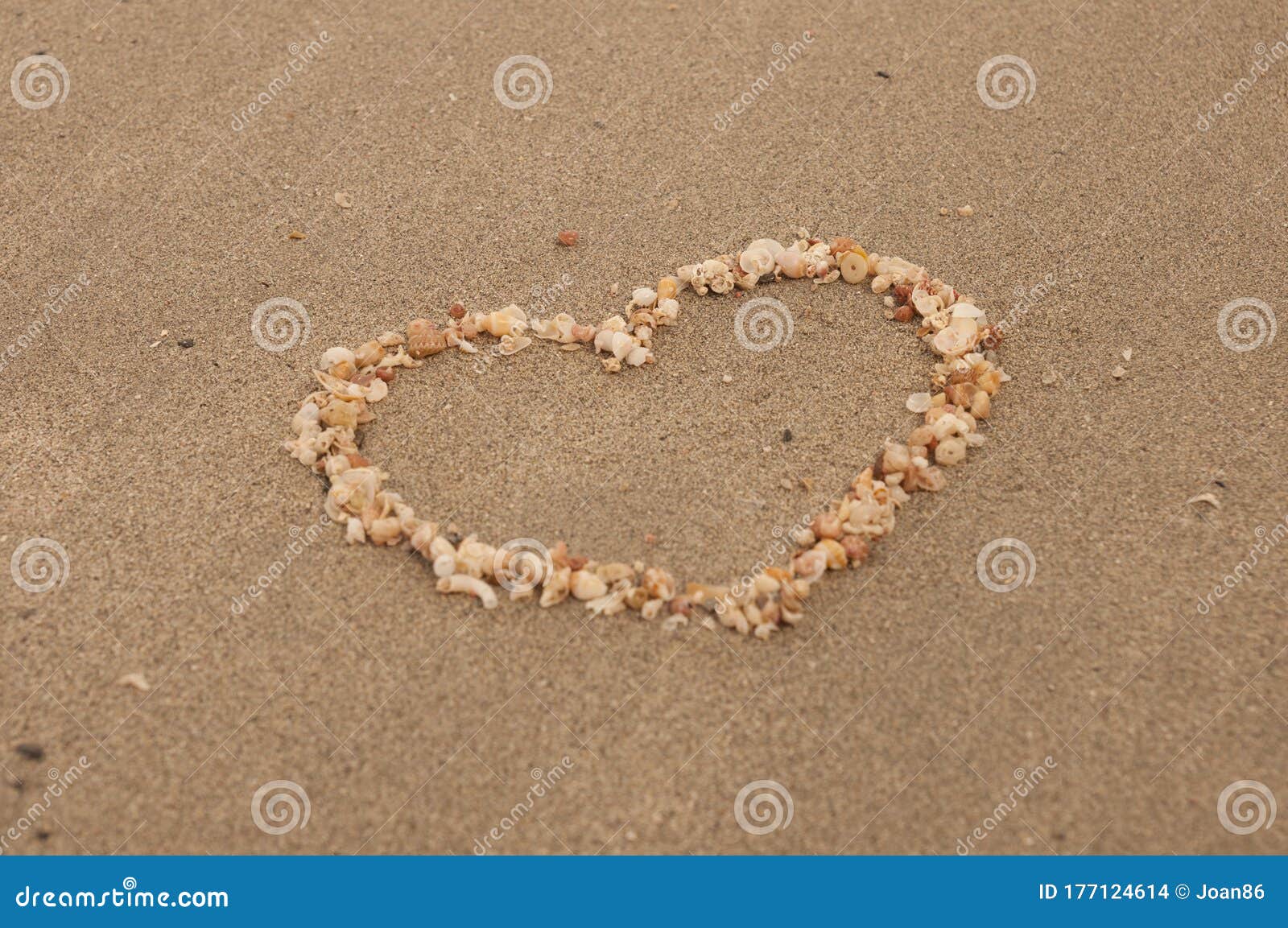 The Shape of Heart Made from Small Shells on the Sand Beach, Selective ...