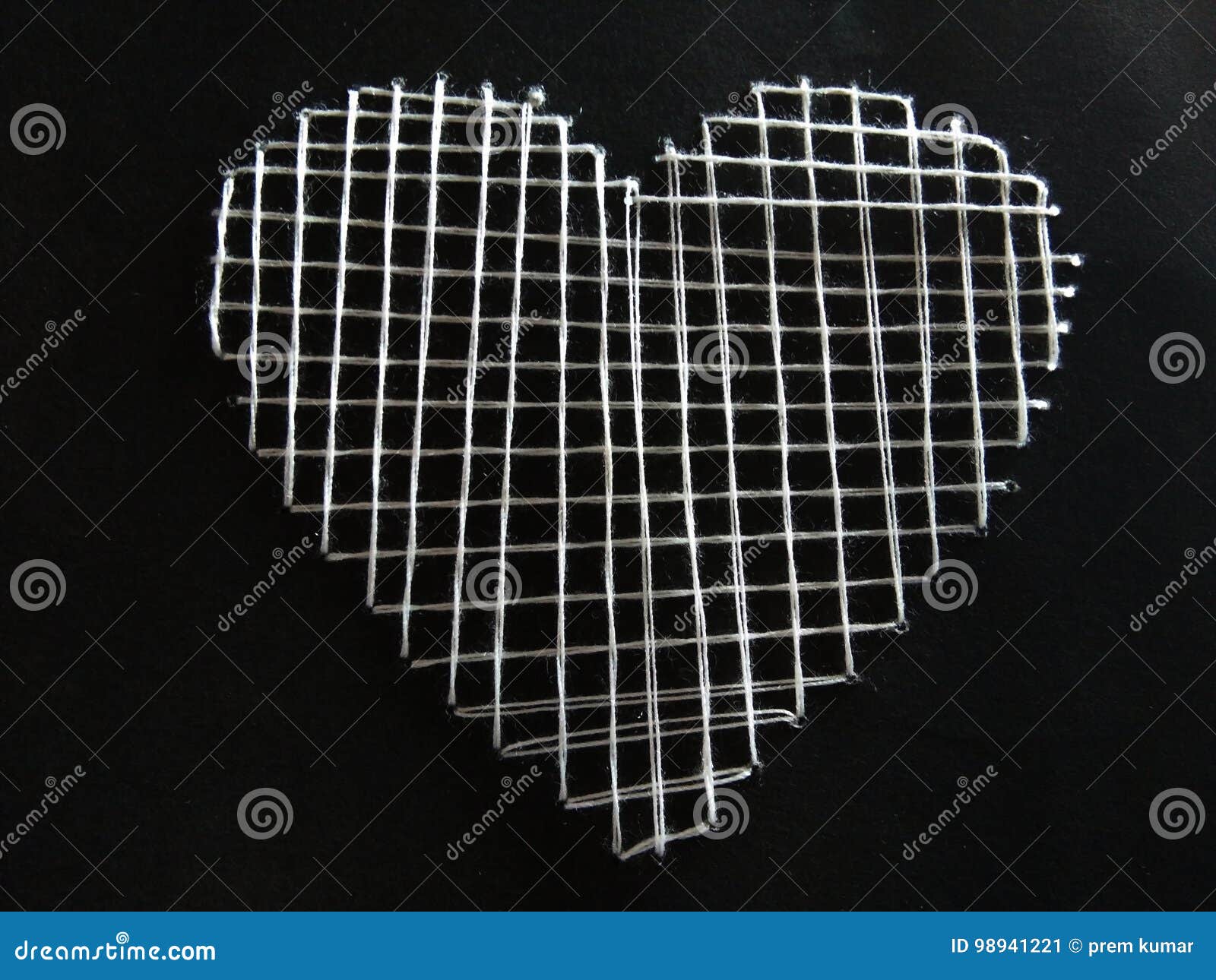 The Shape of the Heart Made of Thread on Black Paper Stock Image ...