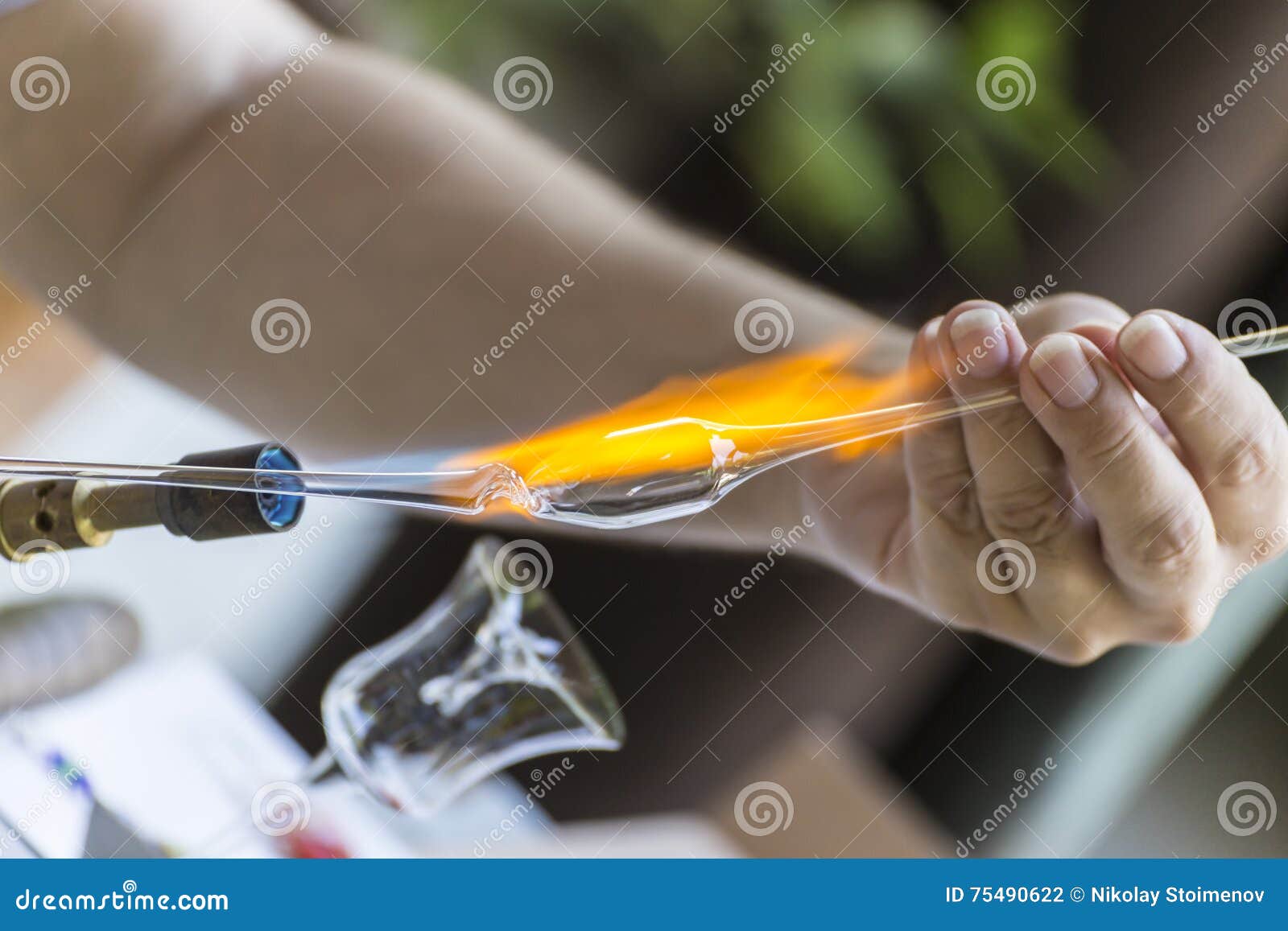 Shaping a piece of glass stock photo. Image of industry - 75490622