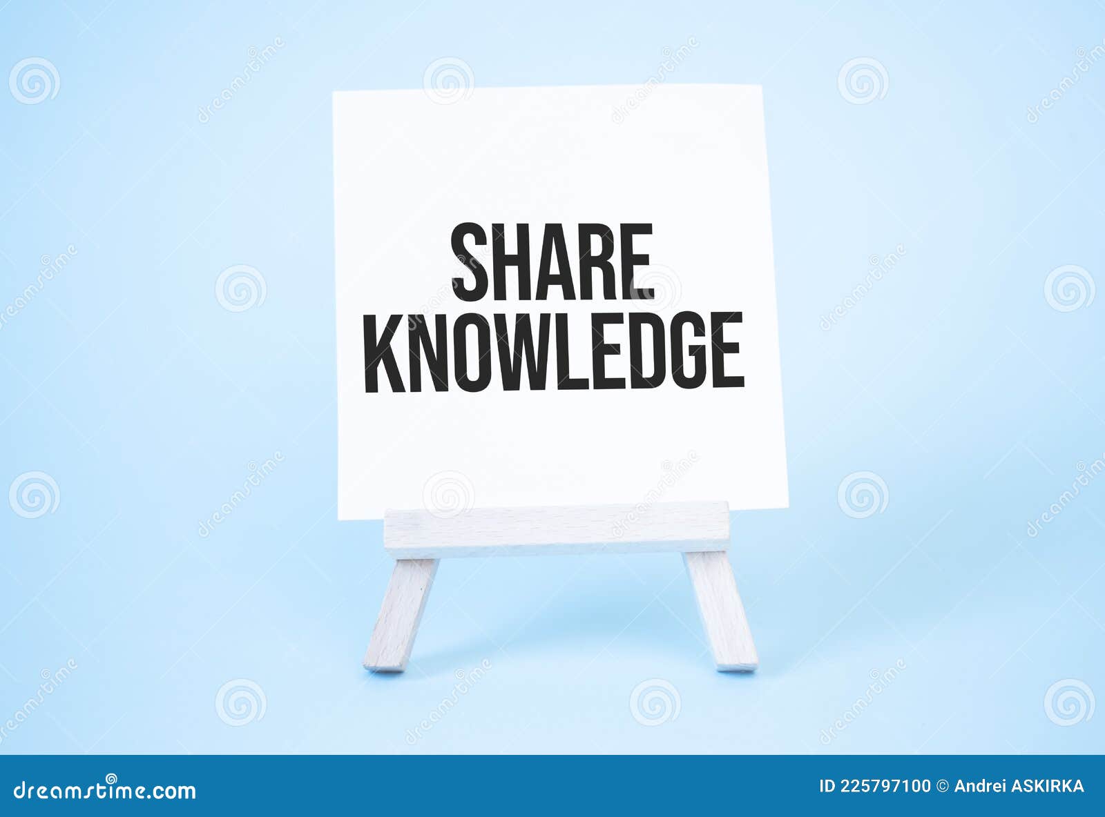SHARE KNOWLEDGE Sign on the White Paper. Easel on the Blue Background ...