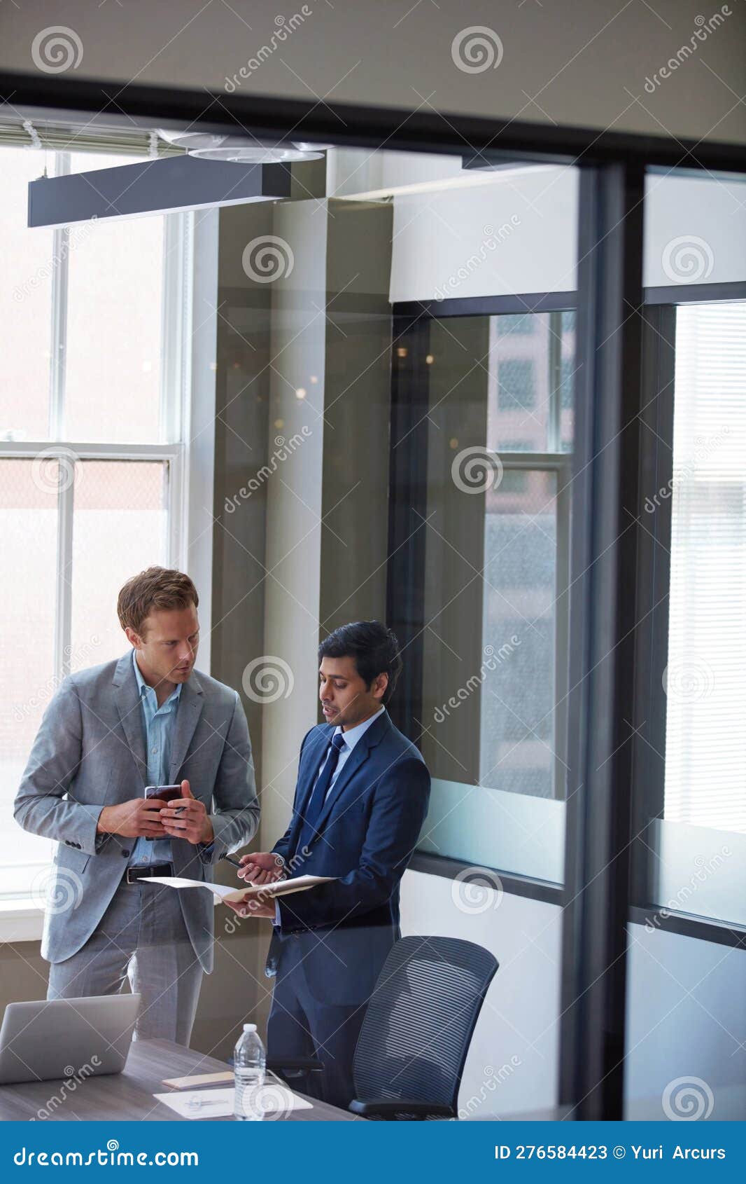 They Share the Same Vision. Businessmen Looking at Paperwork in Their Office. Stock Image ...