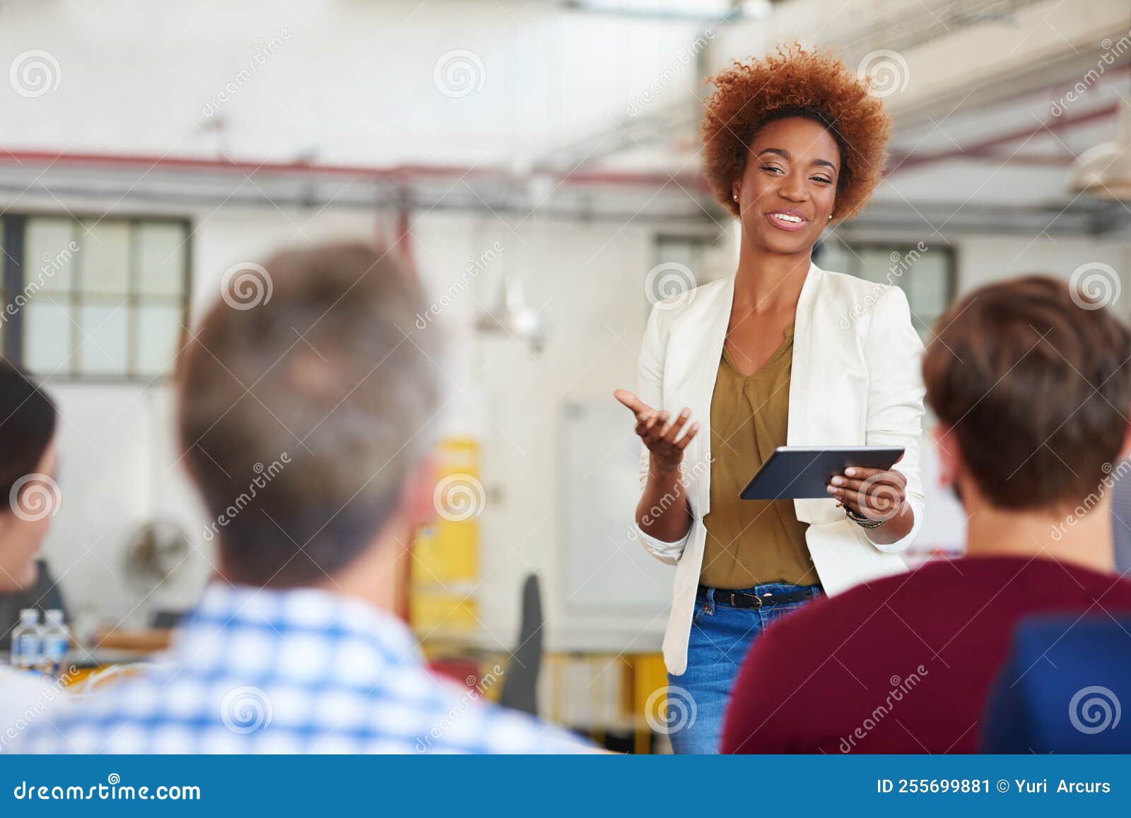 Share Your Knowledge. a Woman Giving a Presentation To Her Colleagues ...