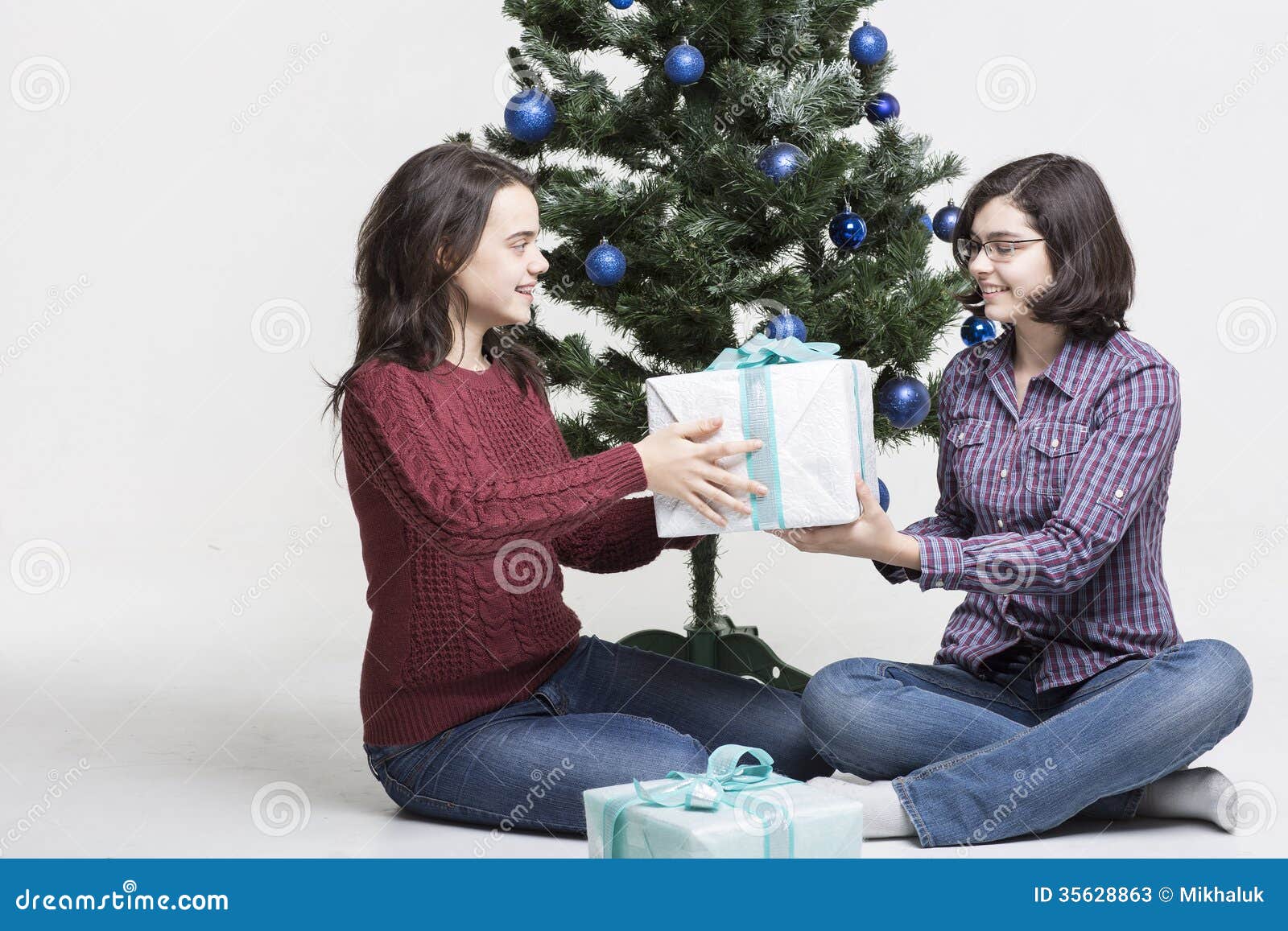 Sharing Christmas gifts stock image. Image of beautiful - 35628863