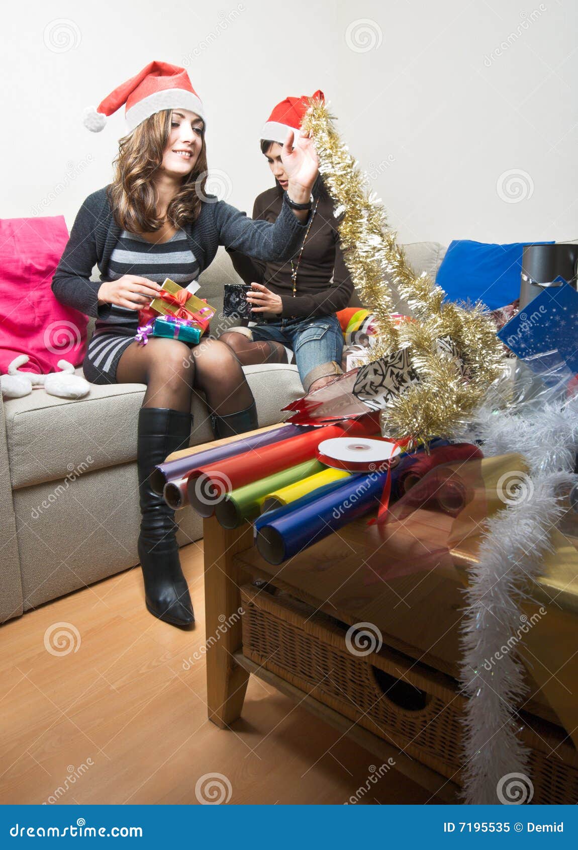 Sharing Christmas Presents stock image. Image of friend - 7195535