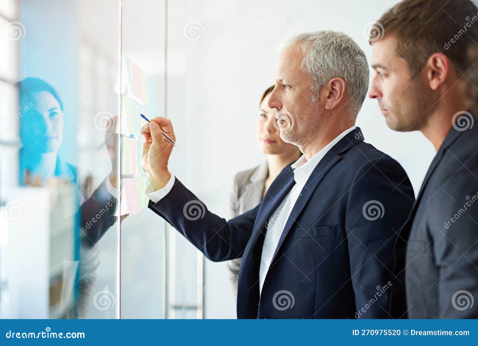 Sharing a Collective Vision. Shot of a Group of Colleagues Having a ...