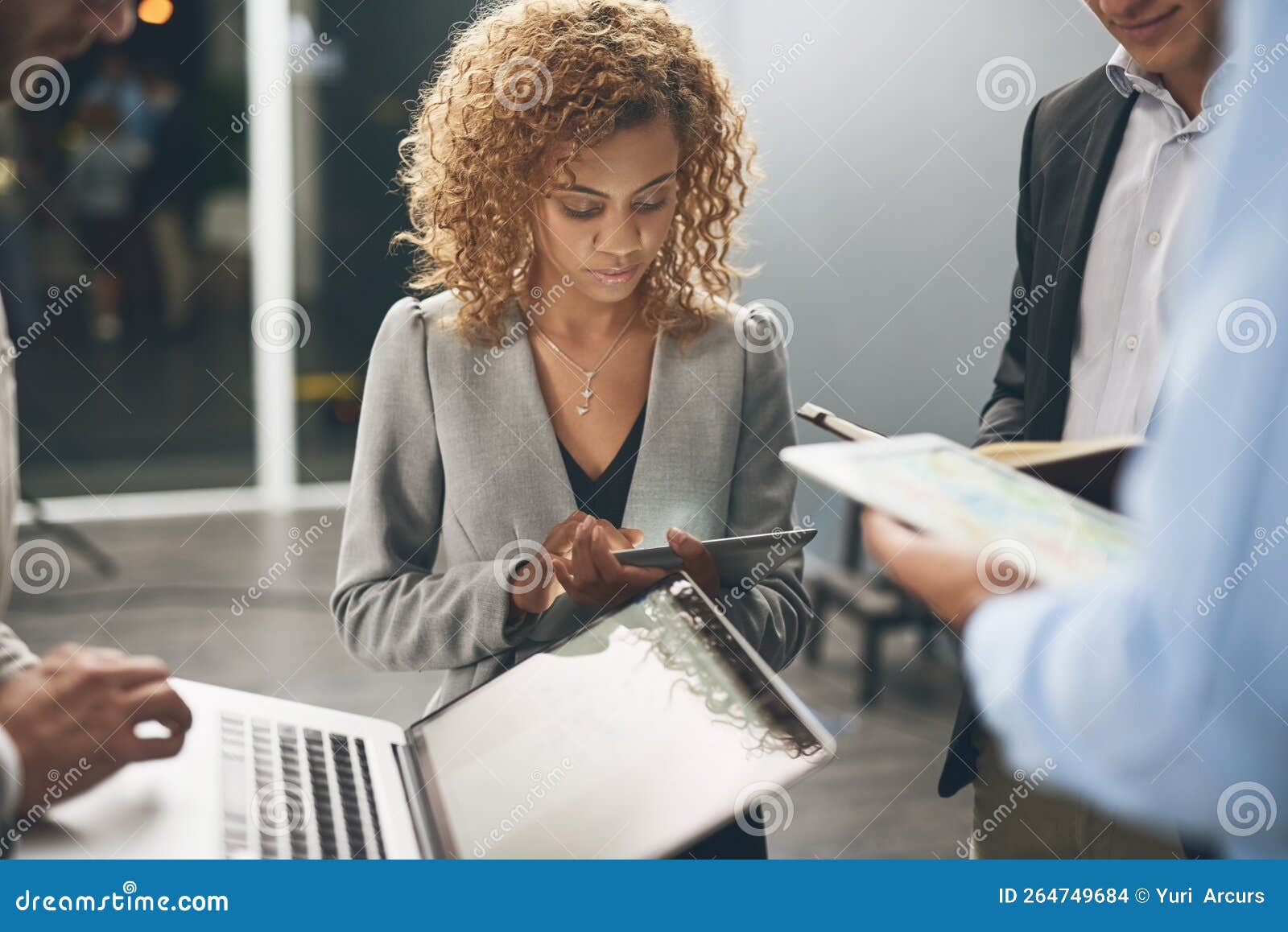 Sharing Connections. a Group of Businesspeople Using Digital Devices ...