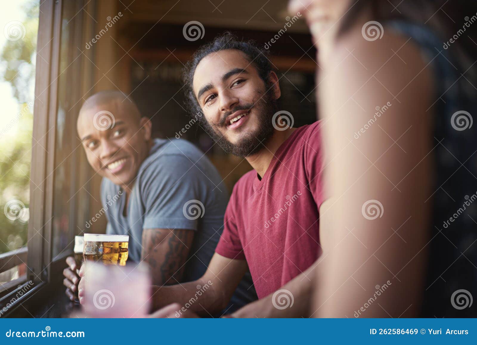 Sharing Drinks and Laughs. a Group of Friends Enjoying Themselves in ...